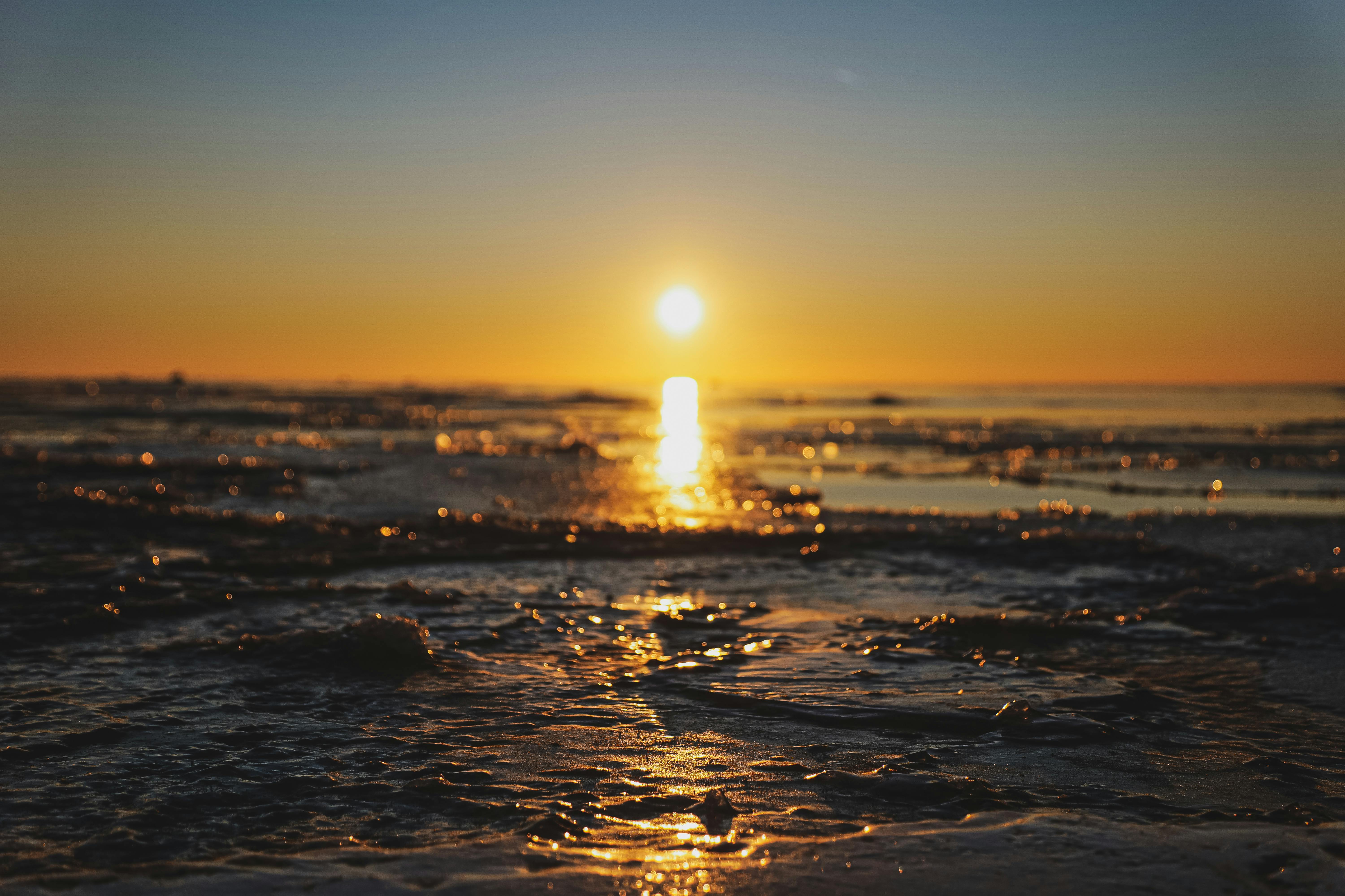 A Golden Sunset Over Body of Water · Free Stock Photo