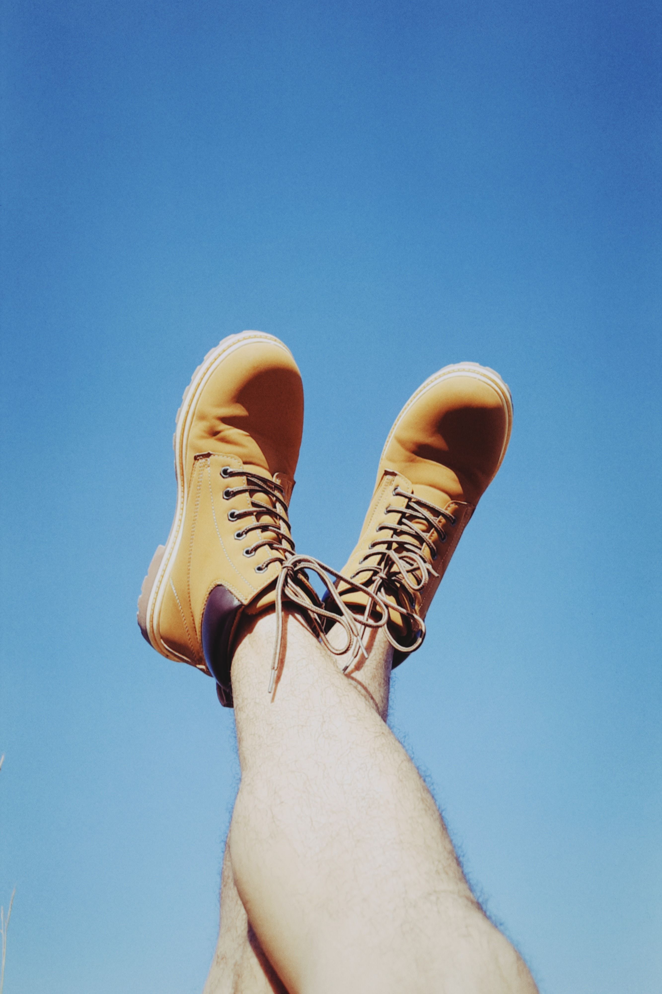 Person Sitting on a Mountain with a View of the Valley · Free Stock Photo
