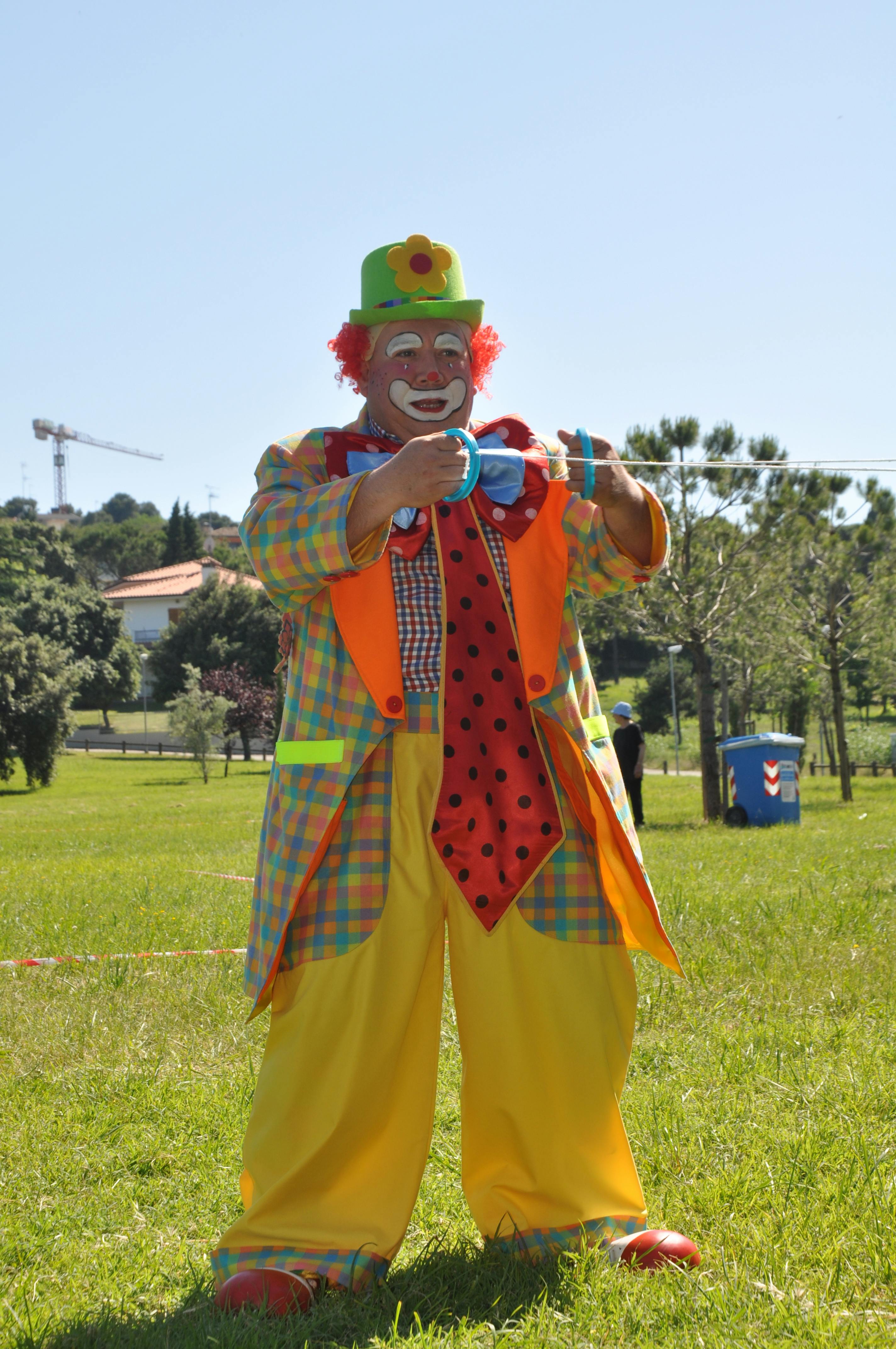 Clown in Yellow and Orange Shirt Standing on Green Grass Field · Free ...
