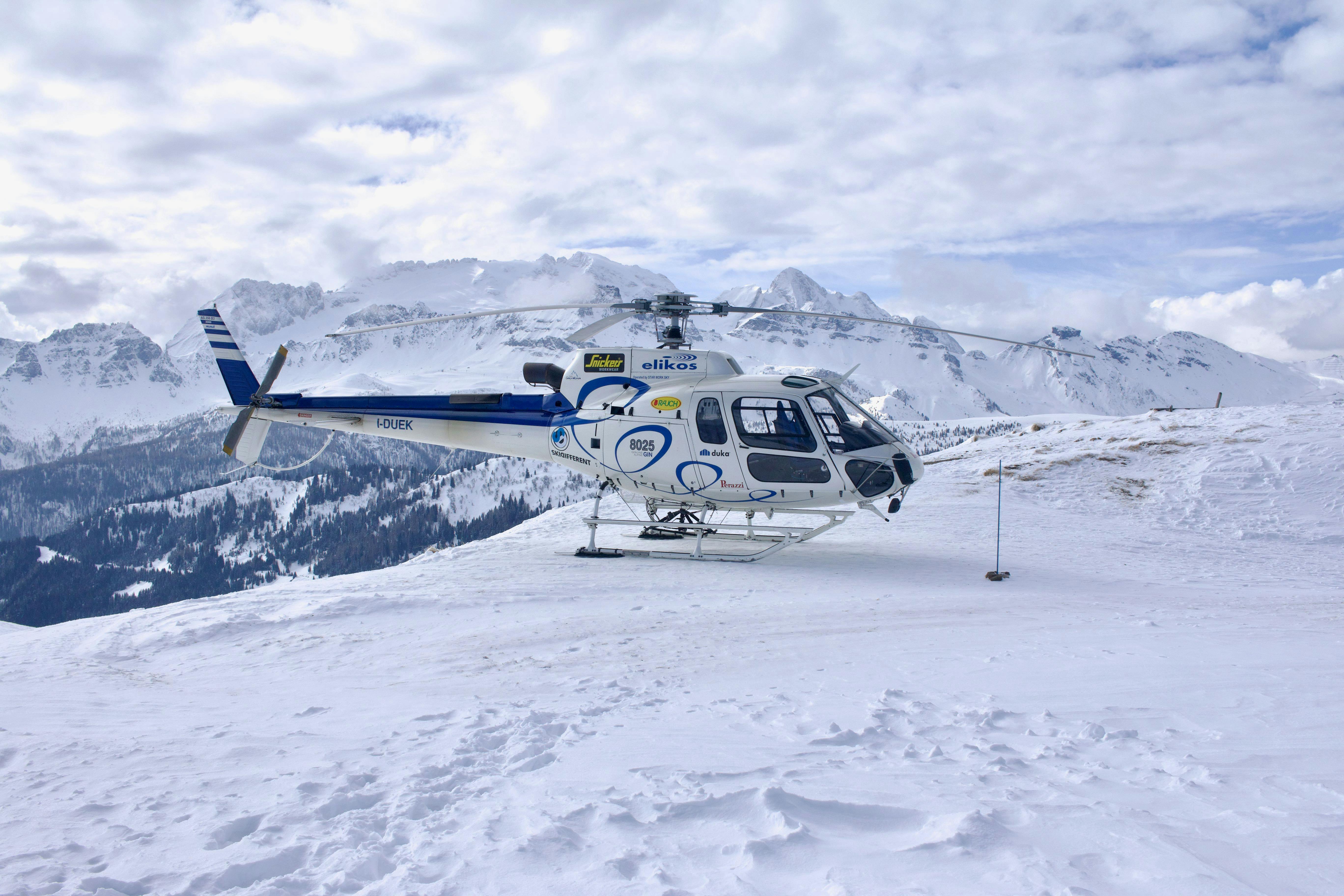 White and Blue Helicopter on Snow Covered Ground · Free Stock Photo