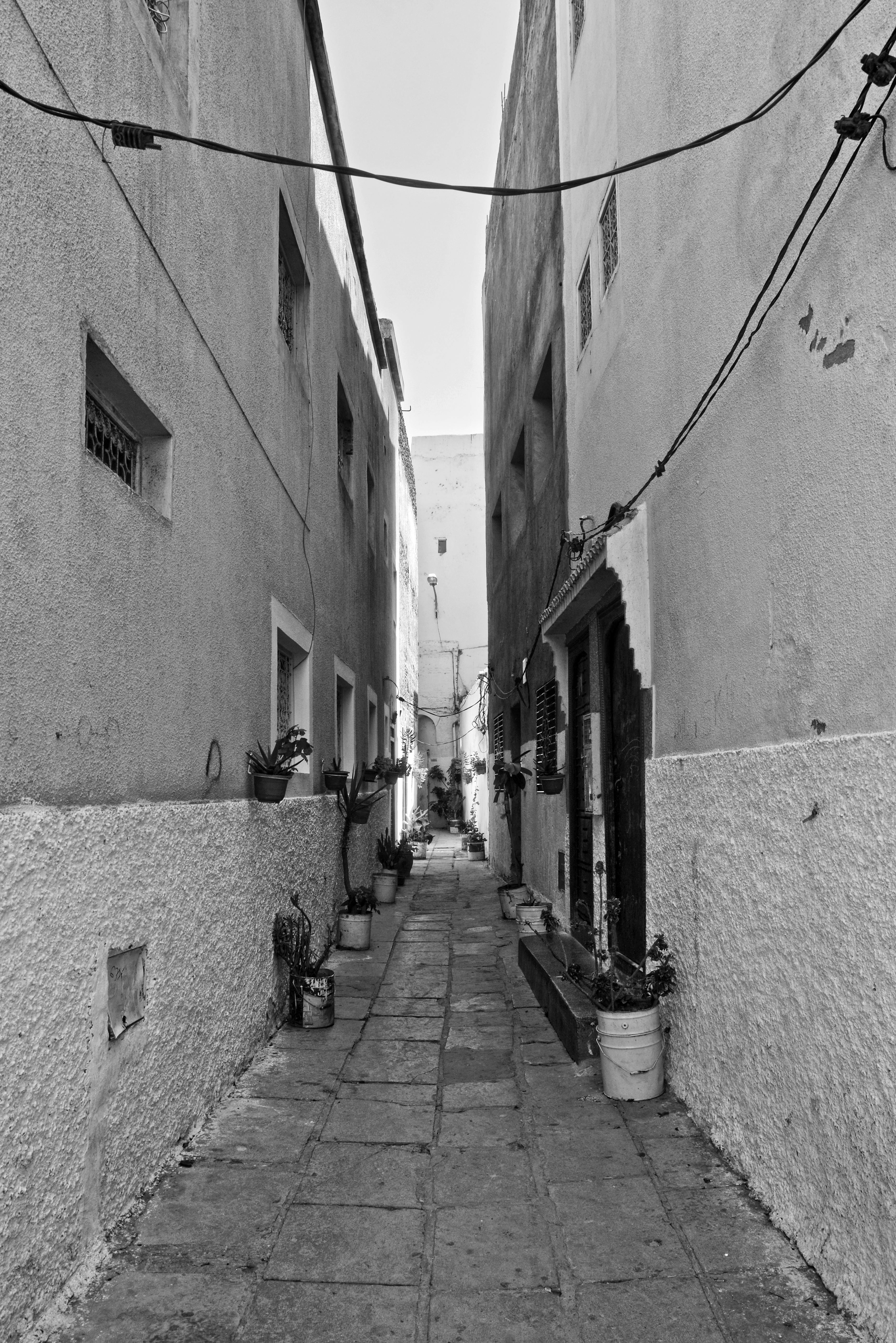 Narrow Alley Between Concrete Buildings · Free Stock Photo