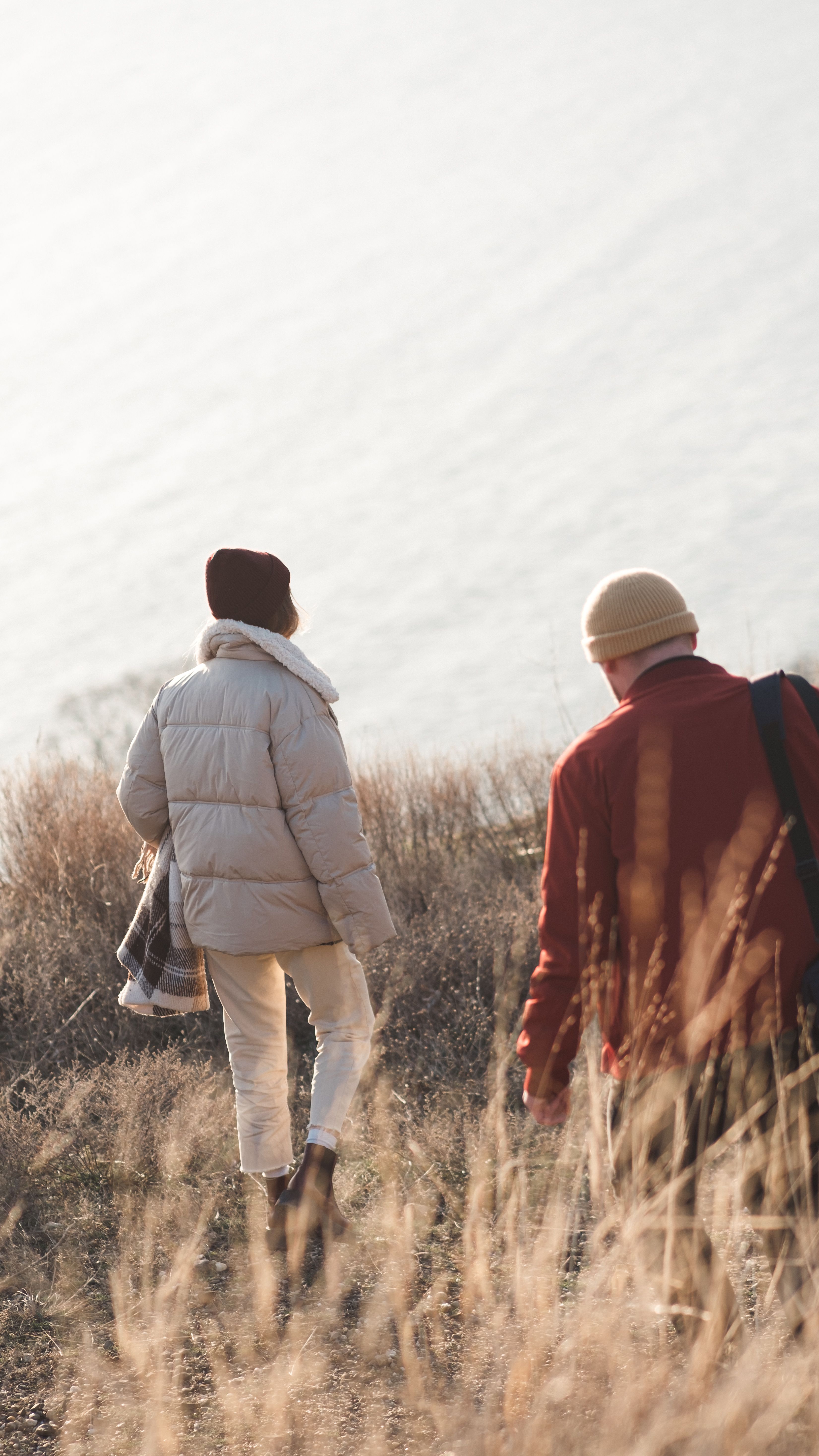 Back View of Person Wearing Puffer Jacket and Brown Beanie · Free Stock ...