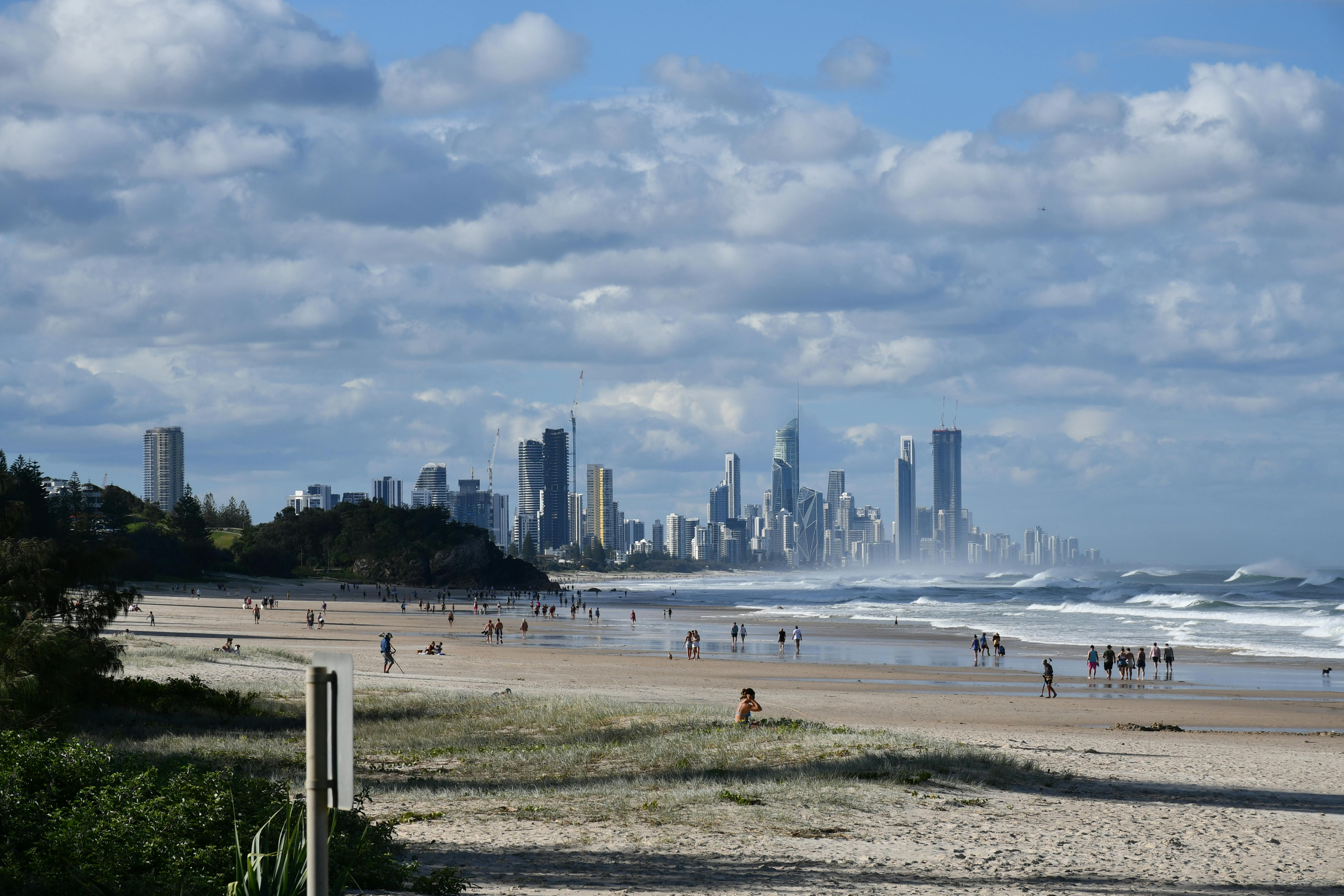 People on Beach under Cloudy Sky · Free Stock Photo