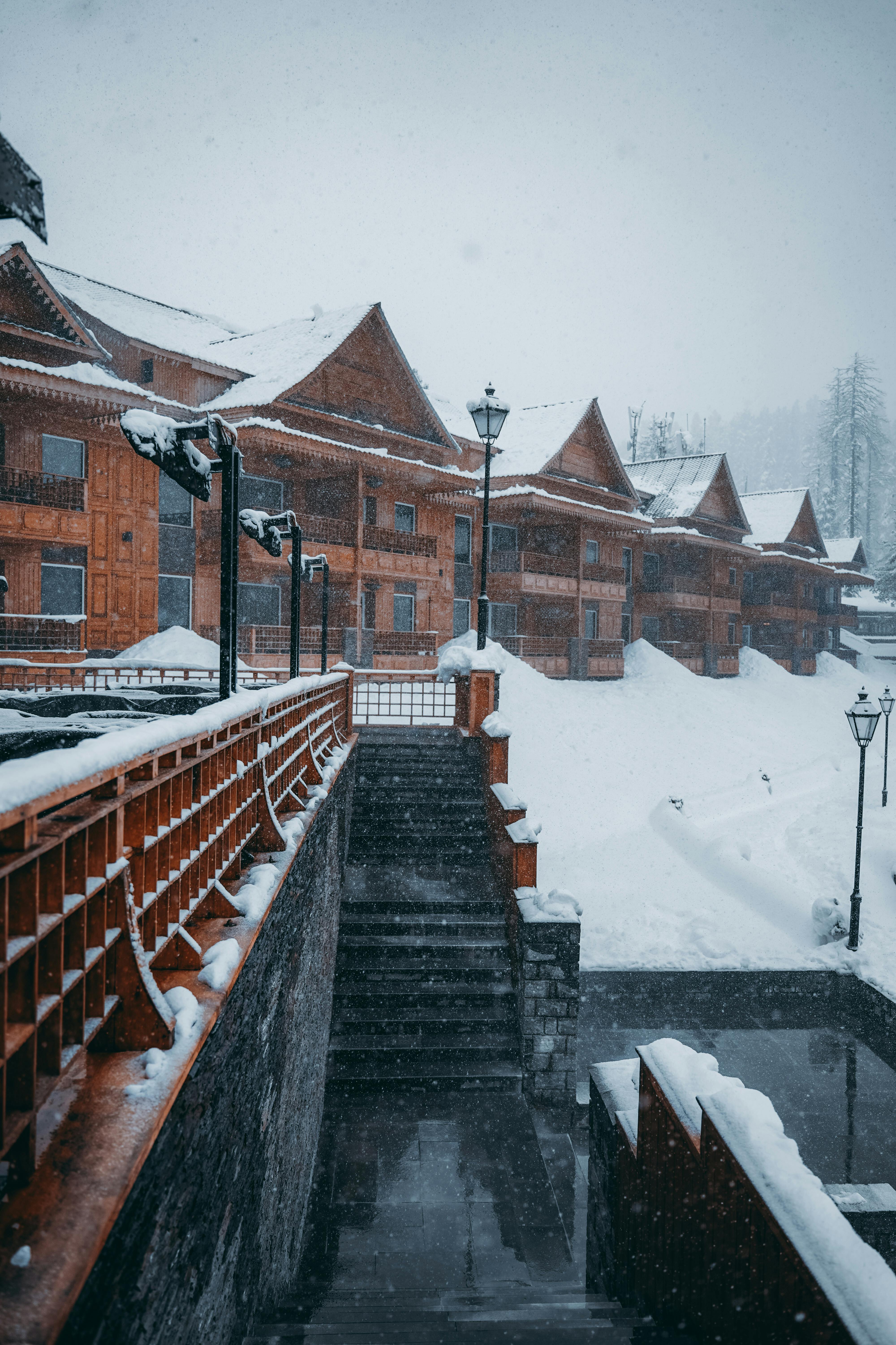 Brown Concrete Building Covered With Snow · Free Stock Photo