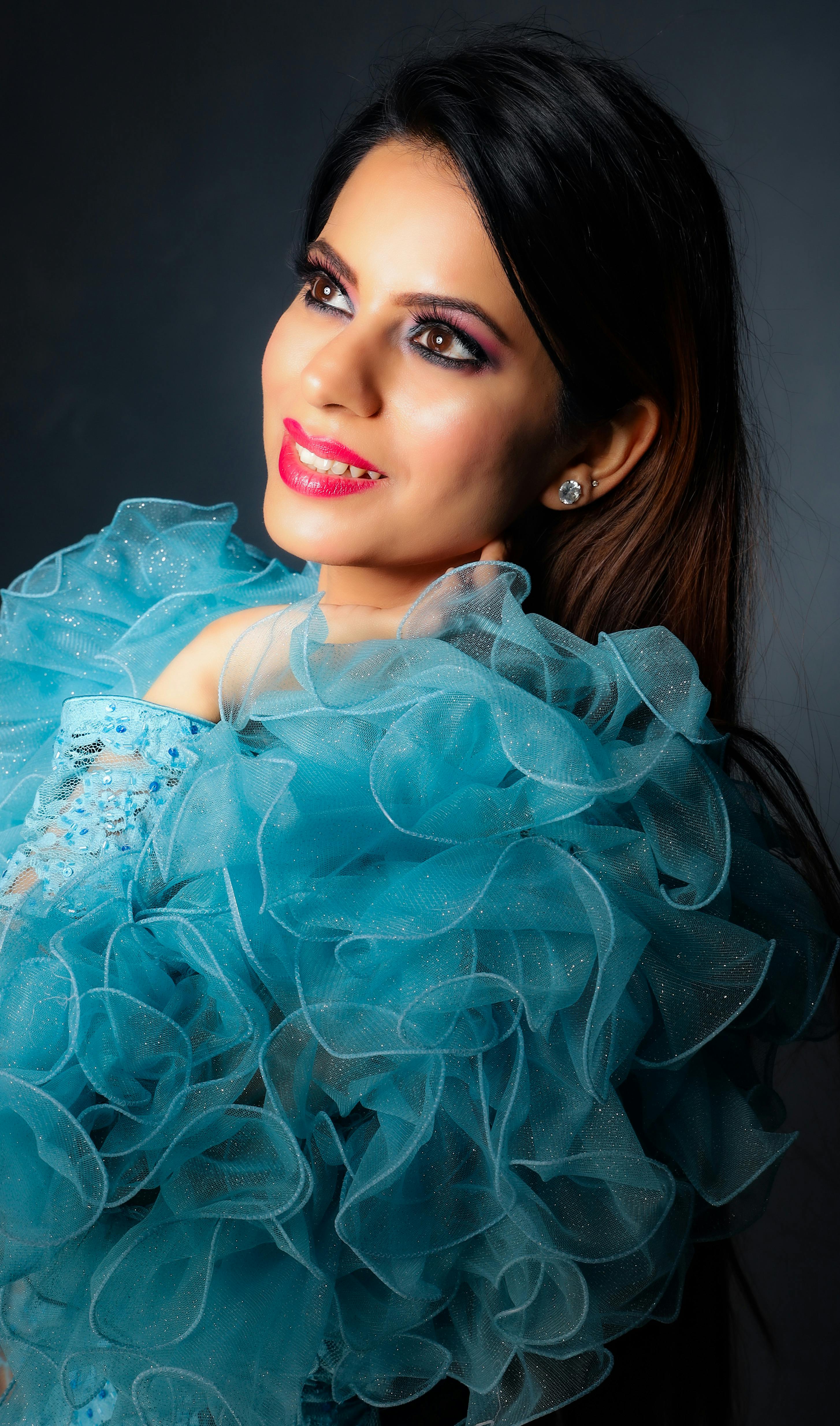 Woman in Blue Ruffle Clothing · Free Stock Photo