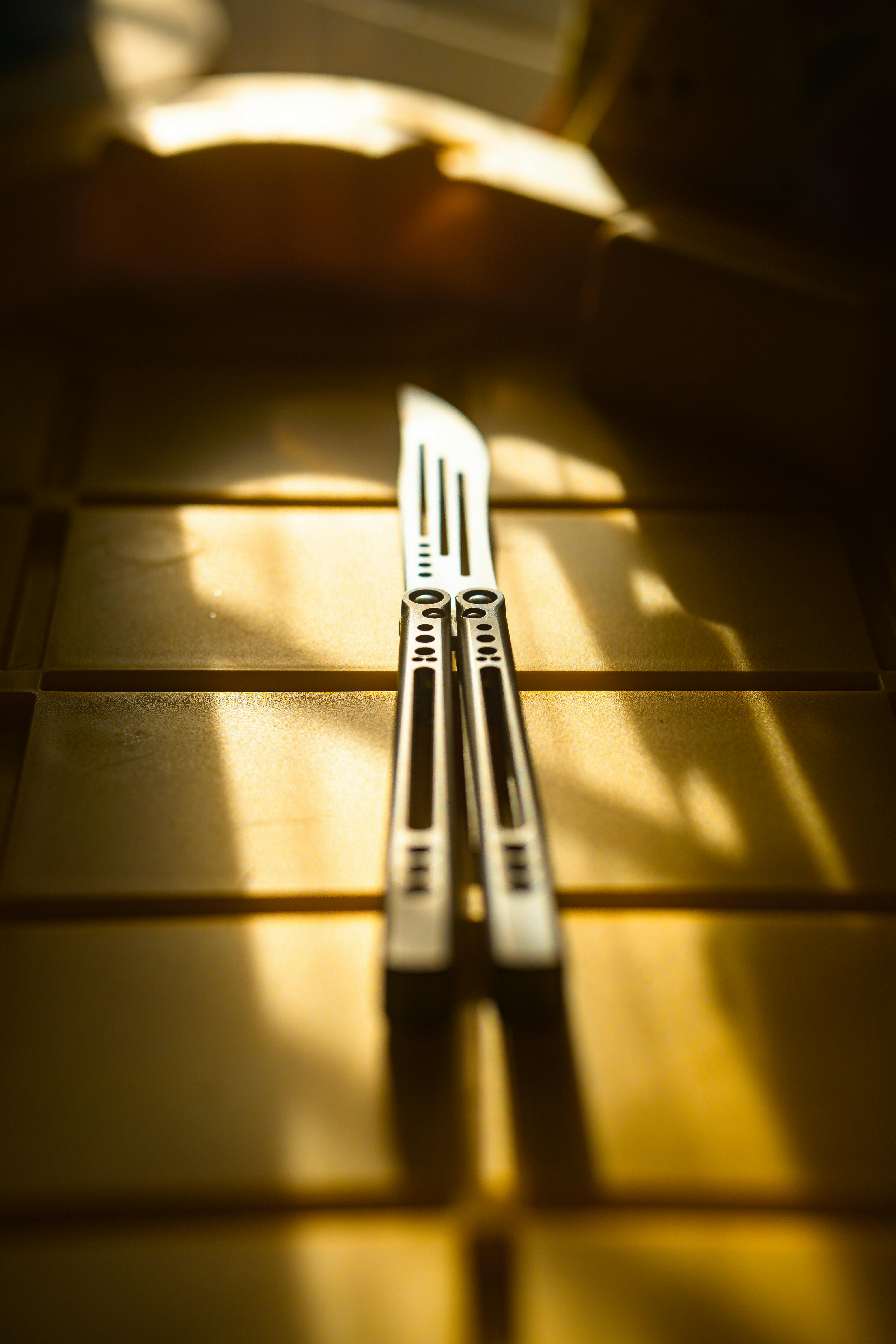 A Person Catching a Knife · Free Stock Photo