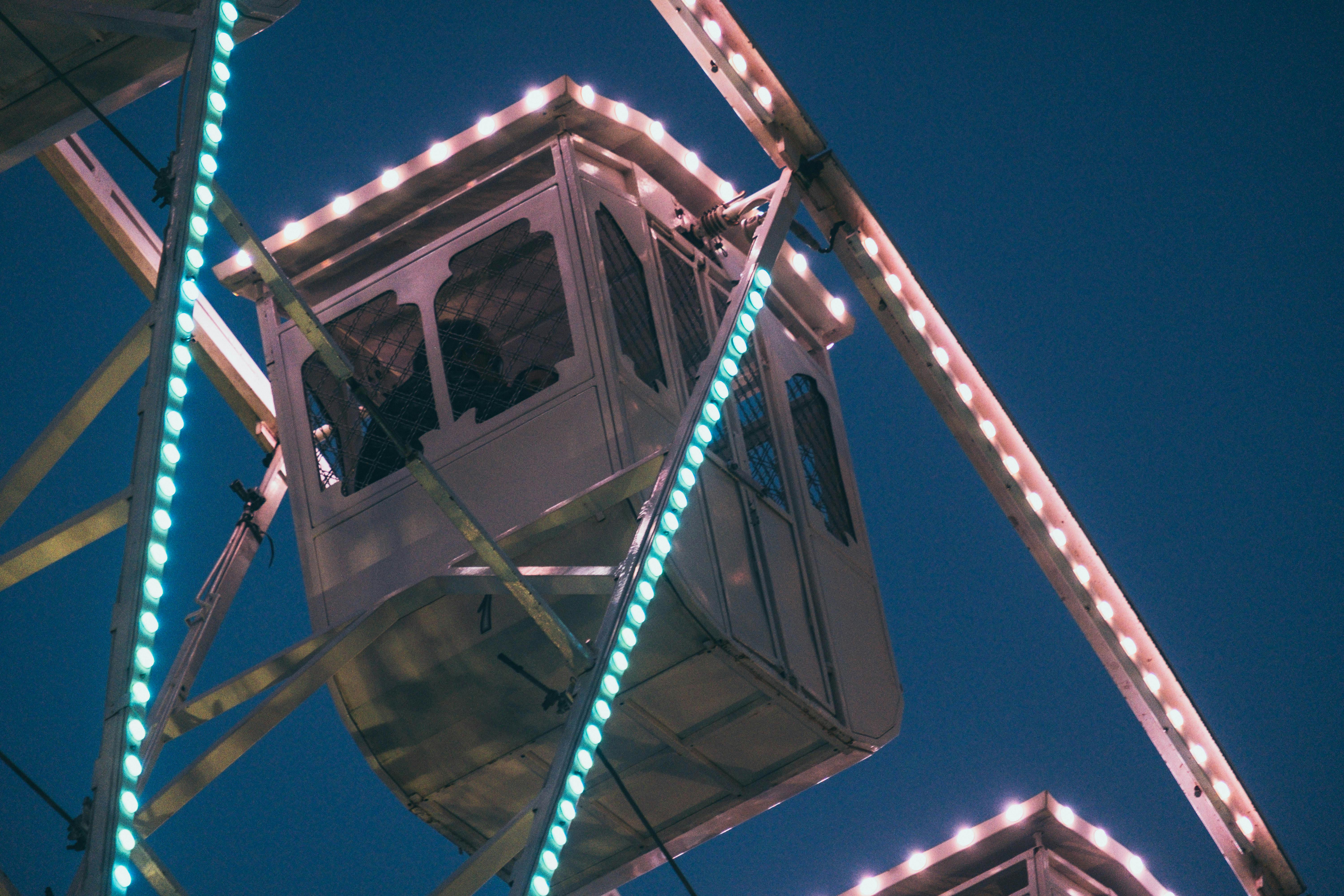 People Inside a Ferris Wheel Carriage · Free Stock Photo