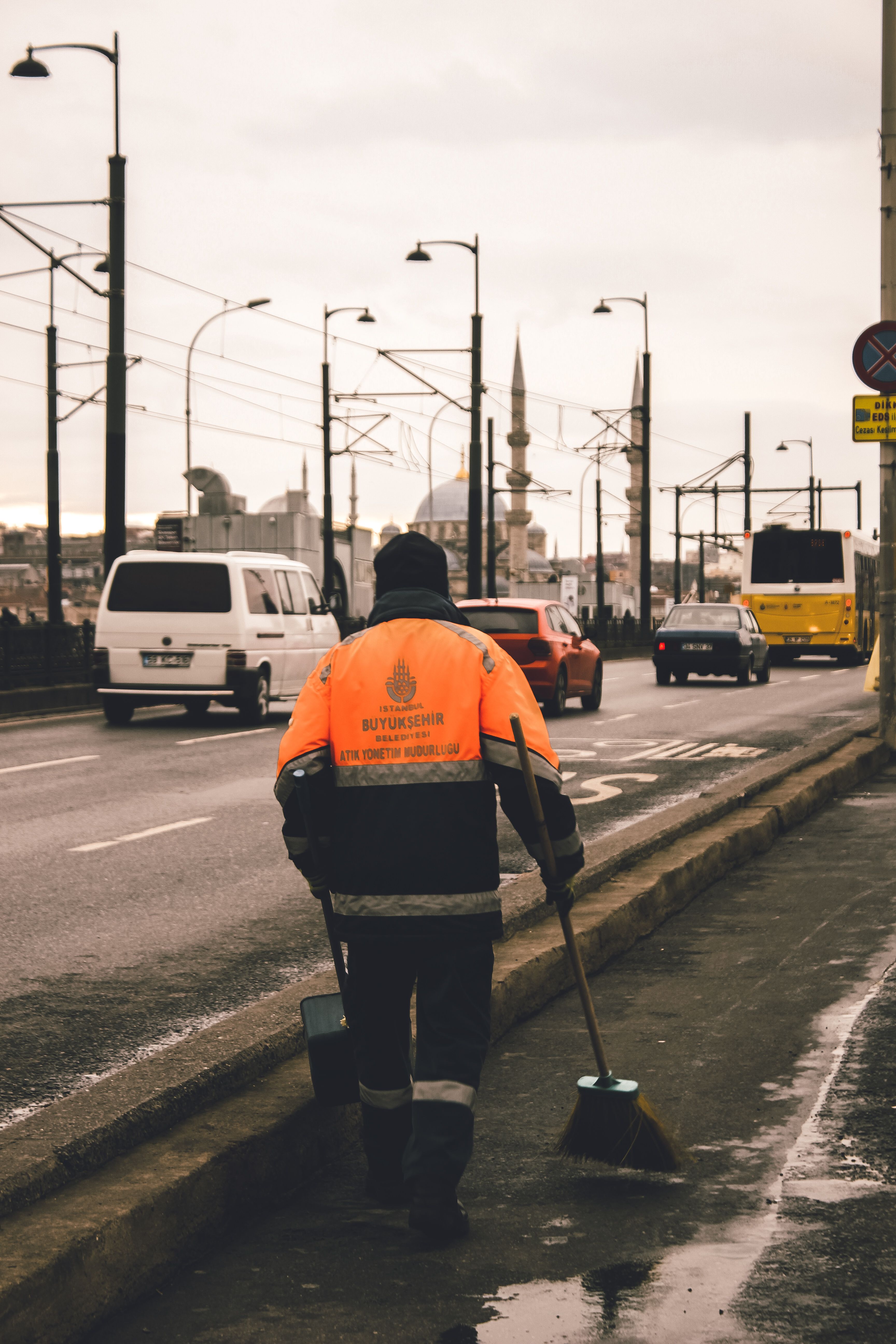 Man Cleaning the Side of a Street · Free Stock Photo