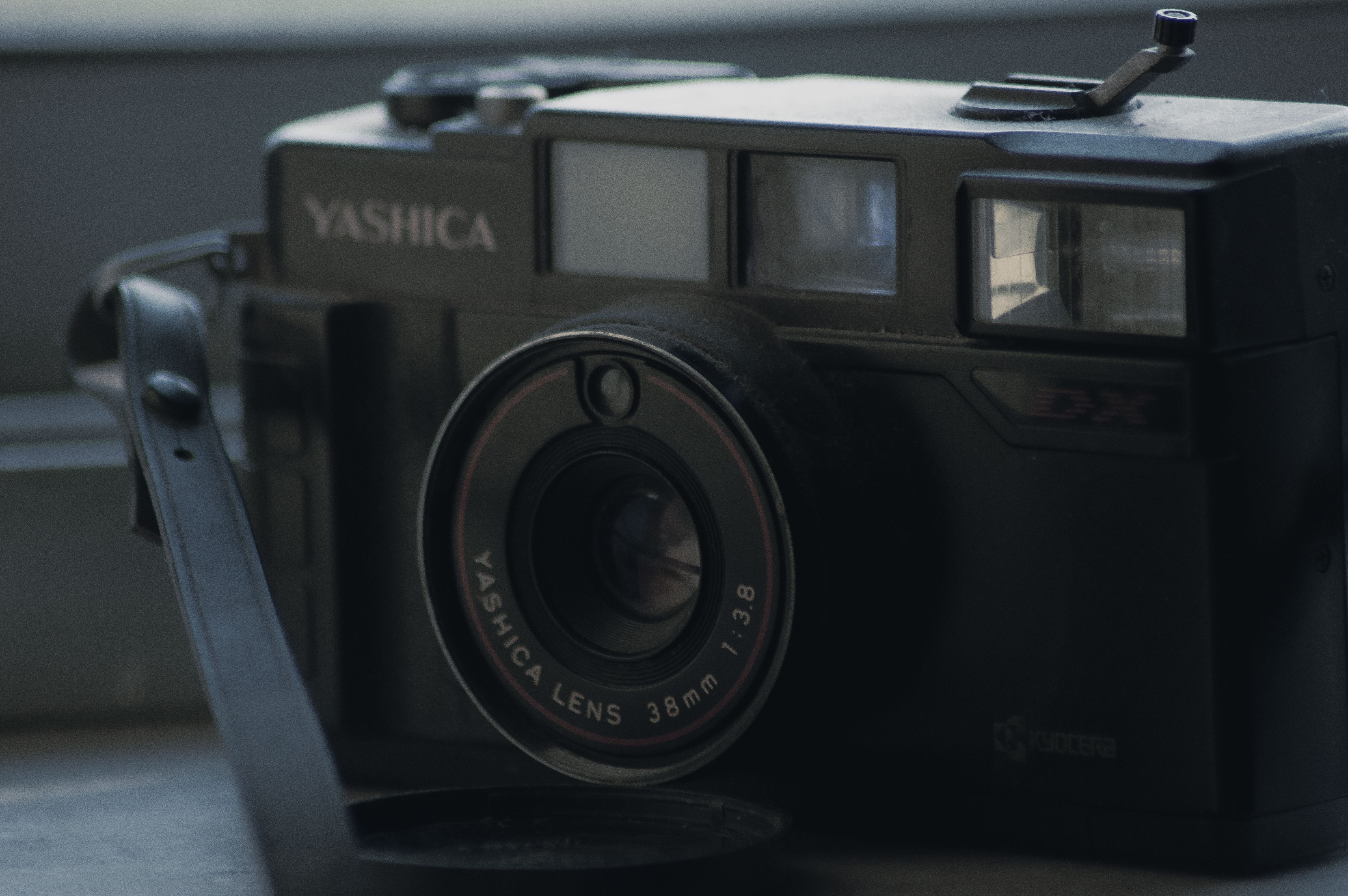 Blakc Camera on White Textile · Free Stock Photo