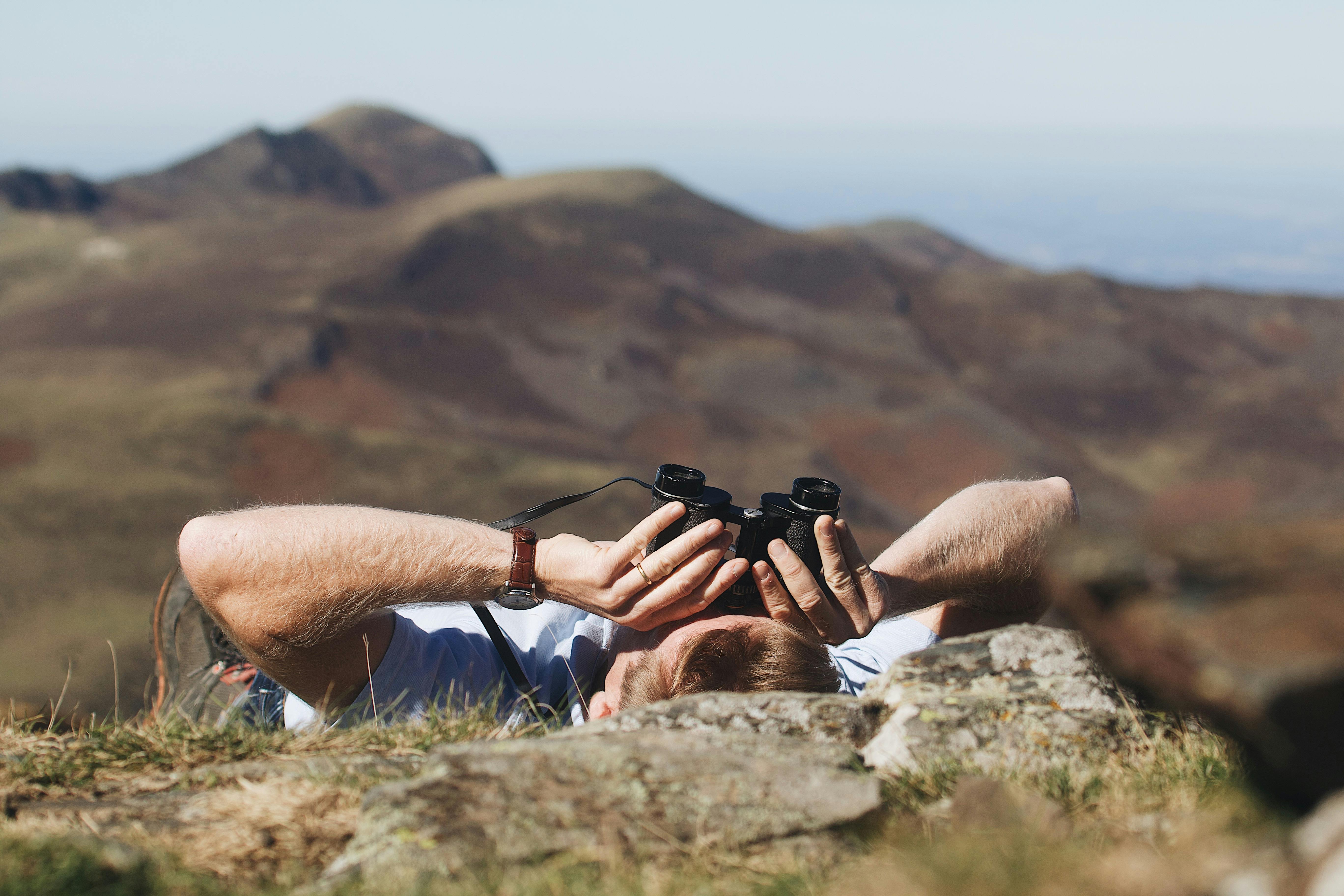 Man using Binoculars · Free Stock Photo