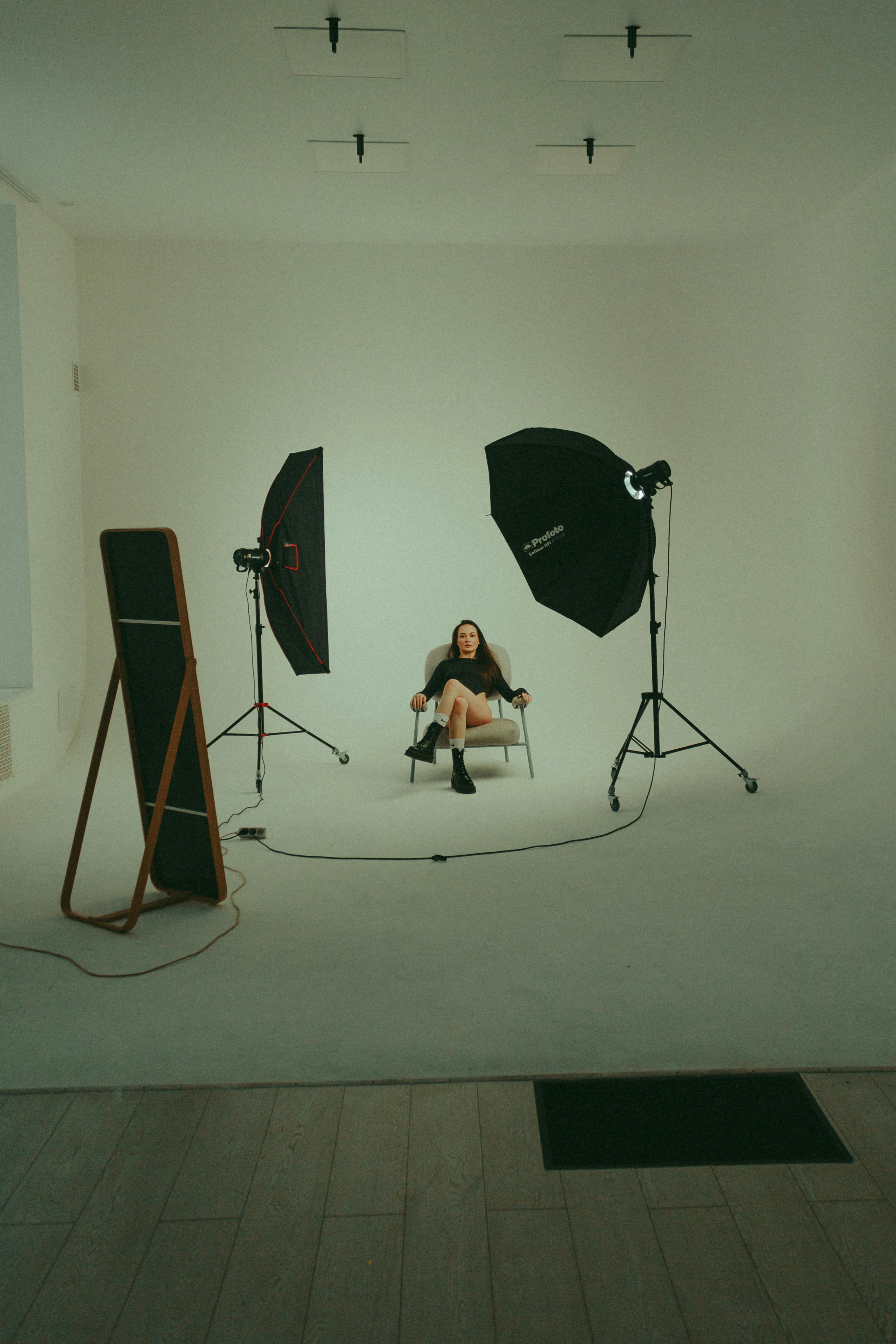A Woman Sitting in a Studio · Free Stock Photo