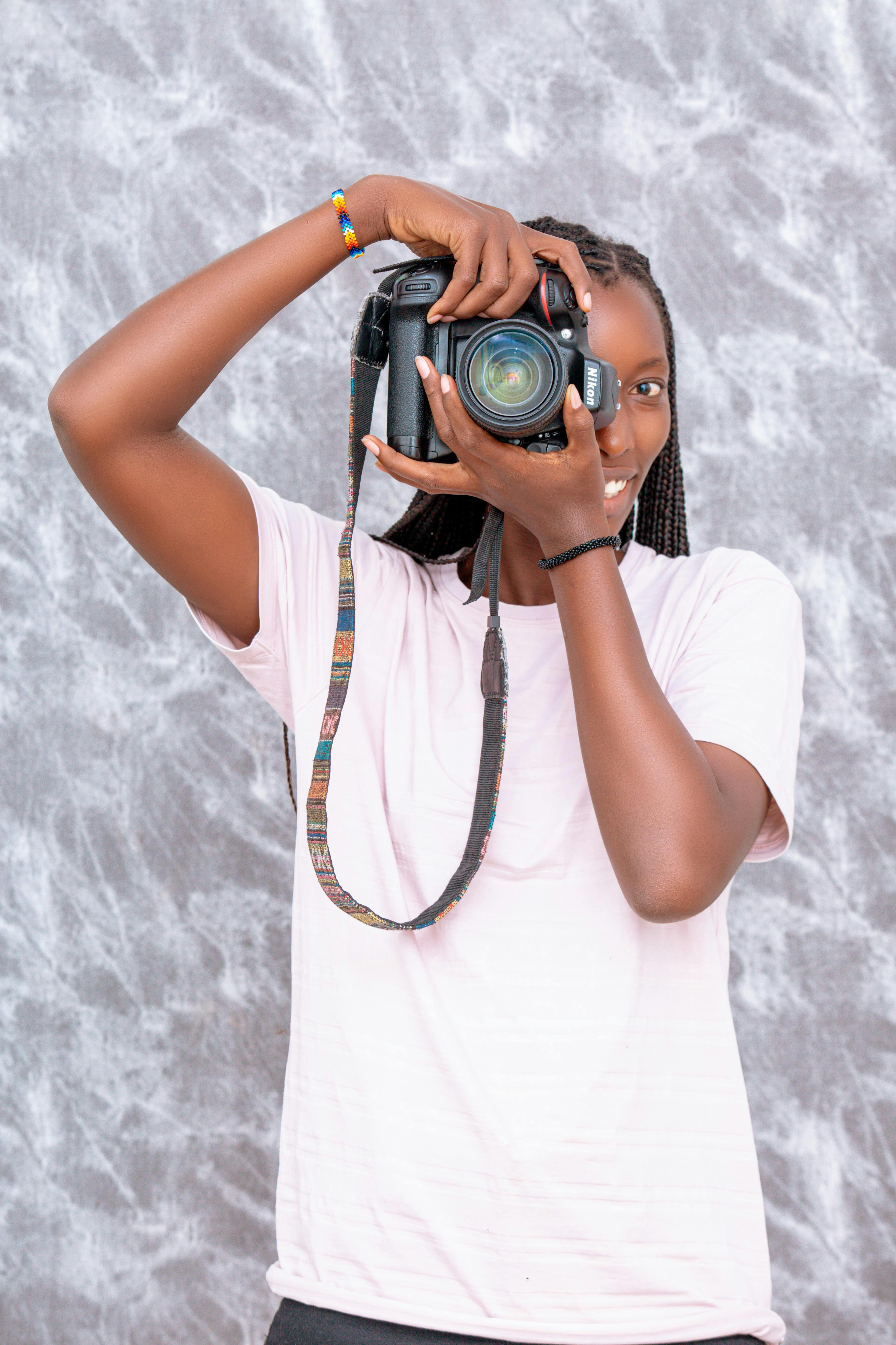 Person Taking Photo Using Black DSLR Camera · Free Stock Photo