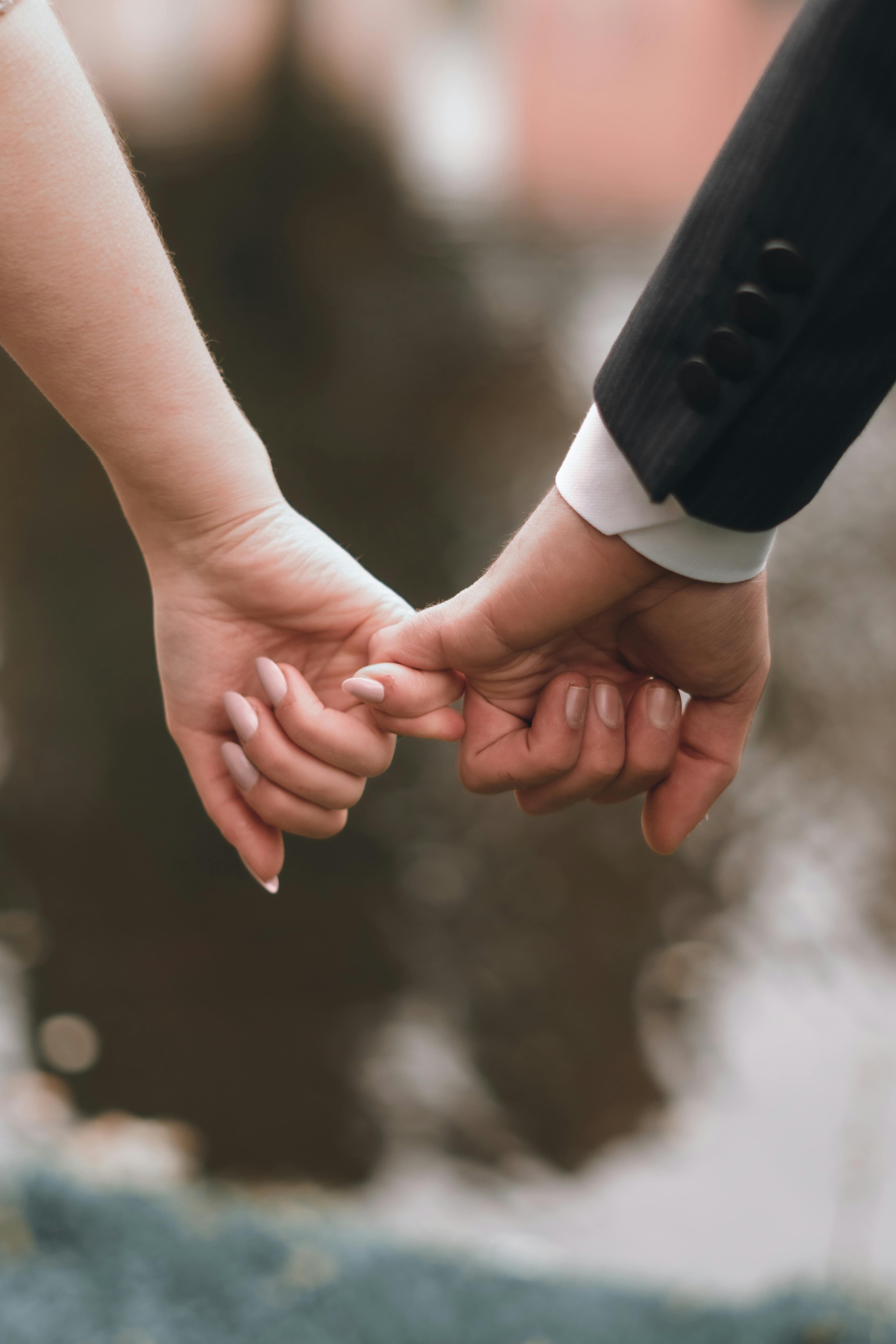 Man and Woman Holding Hands · Free Stock Photo