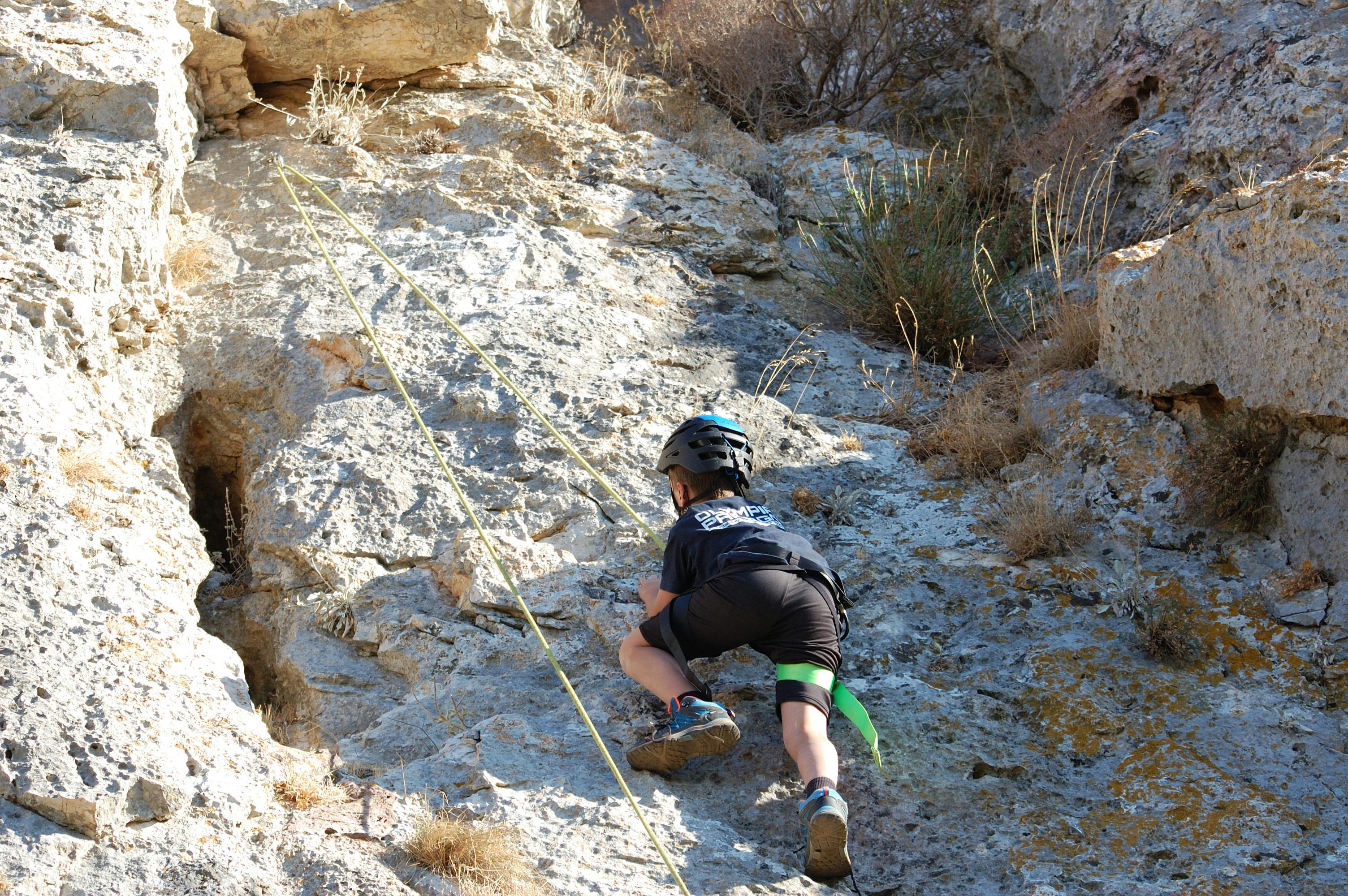 A Mountain Climber Rappelling on a Rope · Free Stock Photo