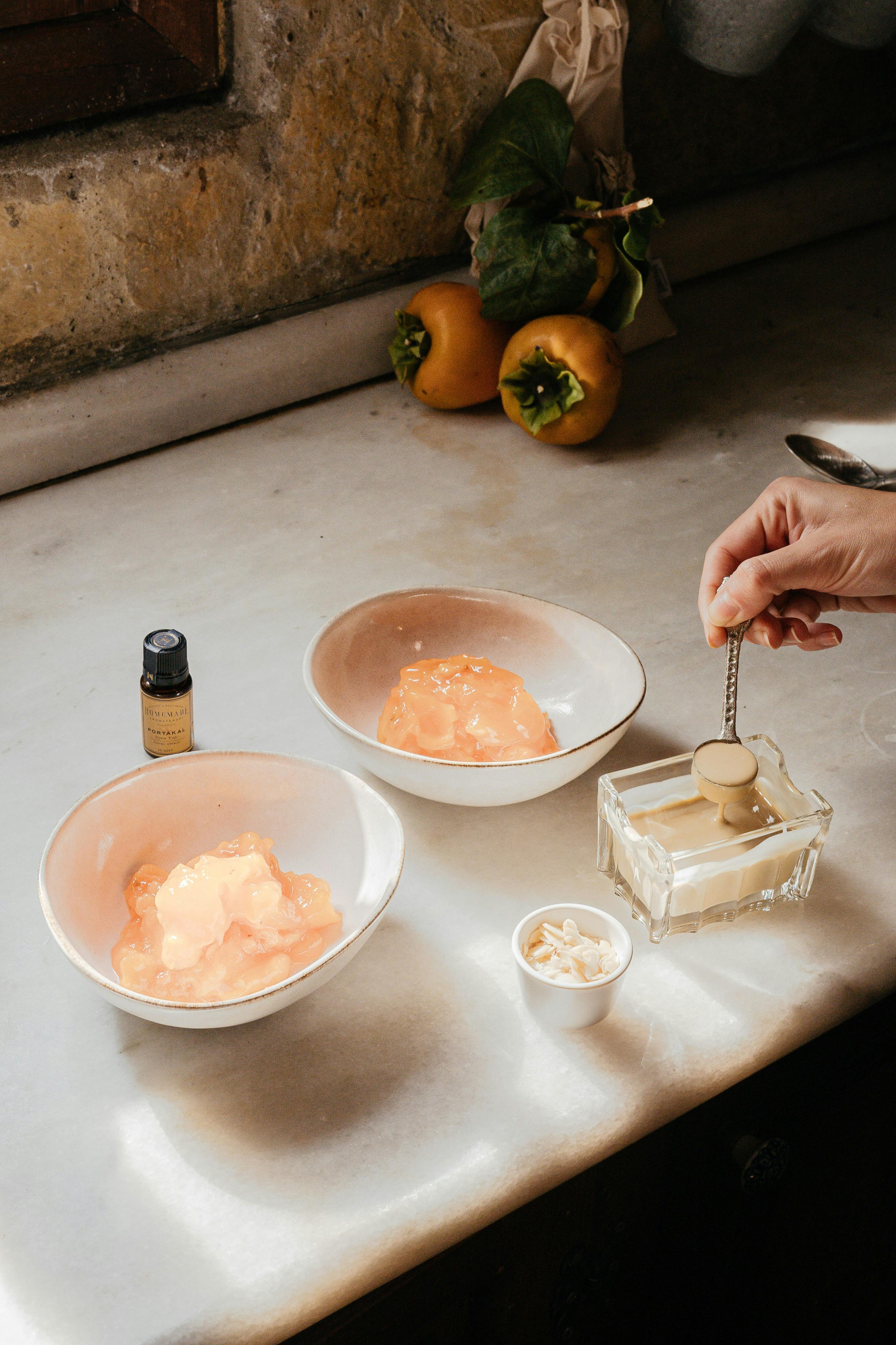 Hand Holding Sauce on Spoon · Free Stock Photo