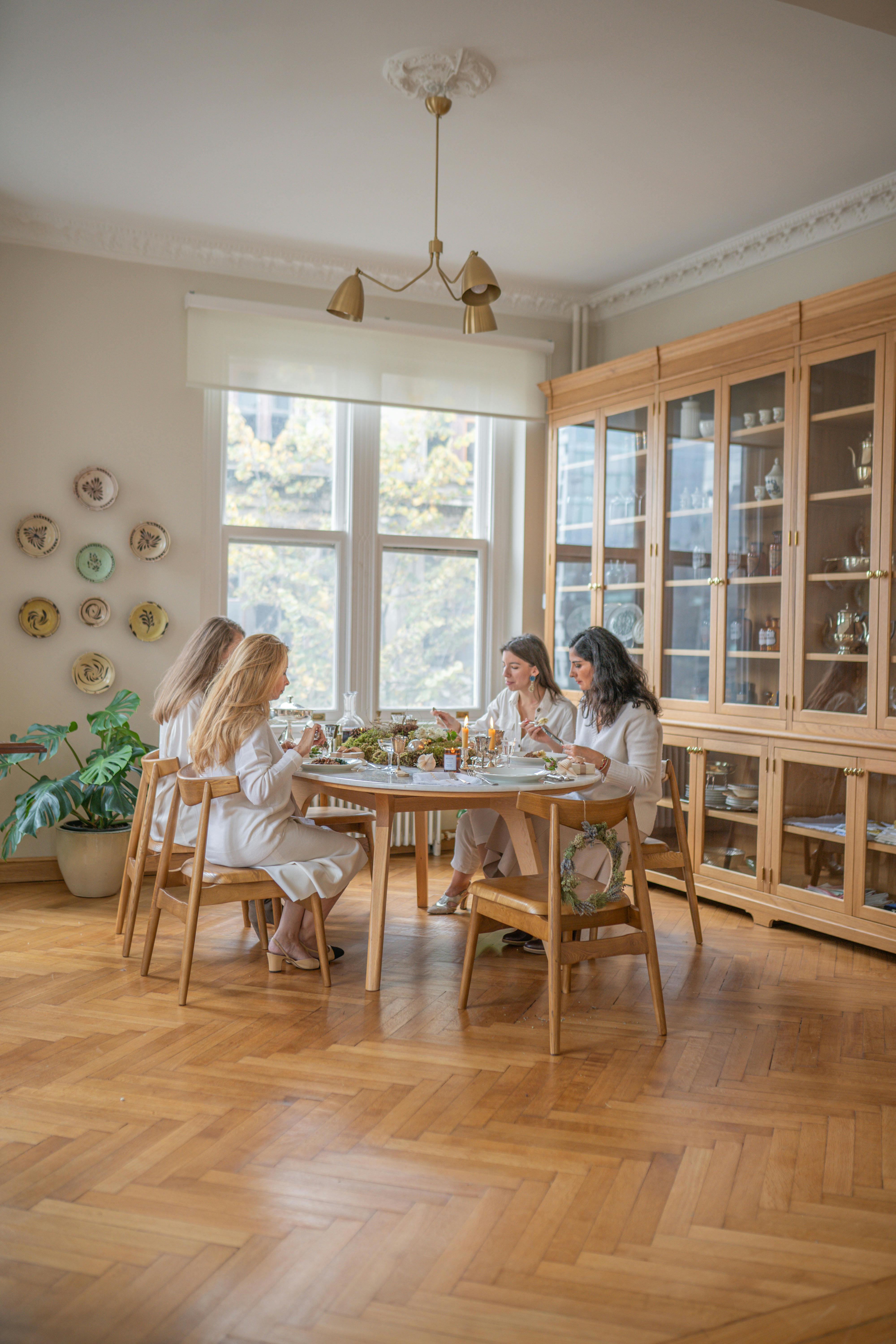People Eating Dinner in Dining Room · Free Stock Photo
