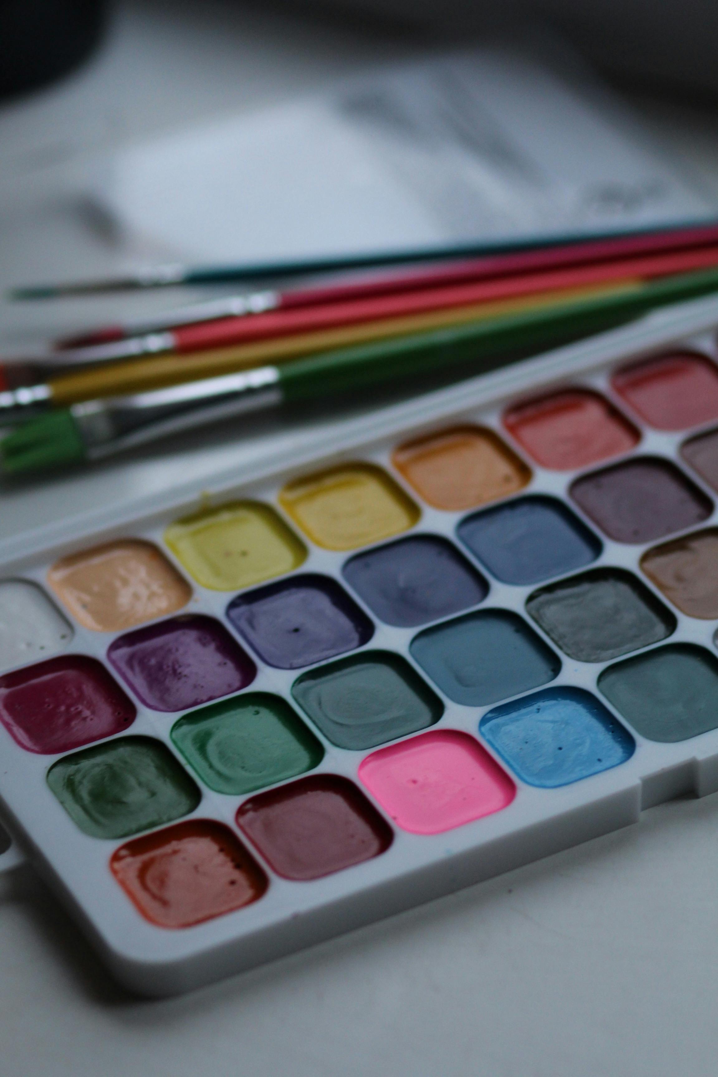 Colorful Water Color Palette on White Surface · Free Stock Photo