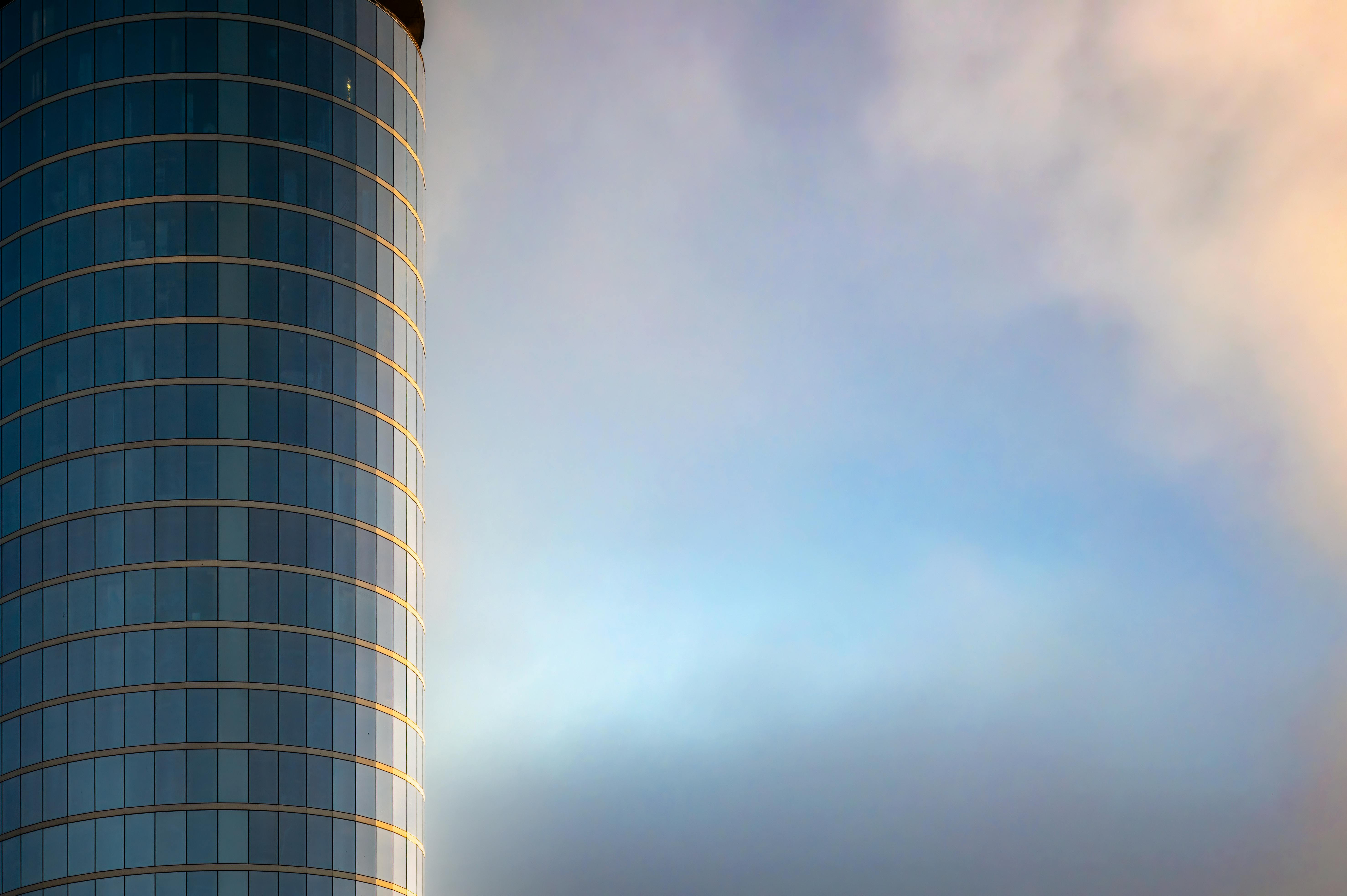 Glass Concrete Building Near Beautiful Sky · Free Stock Photo