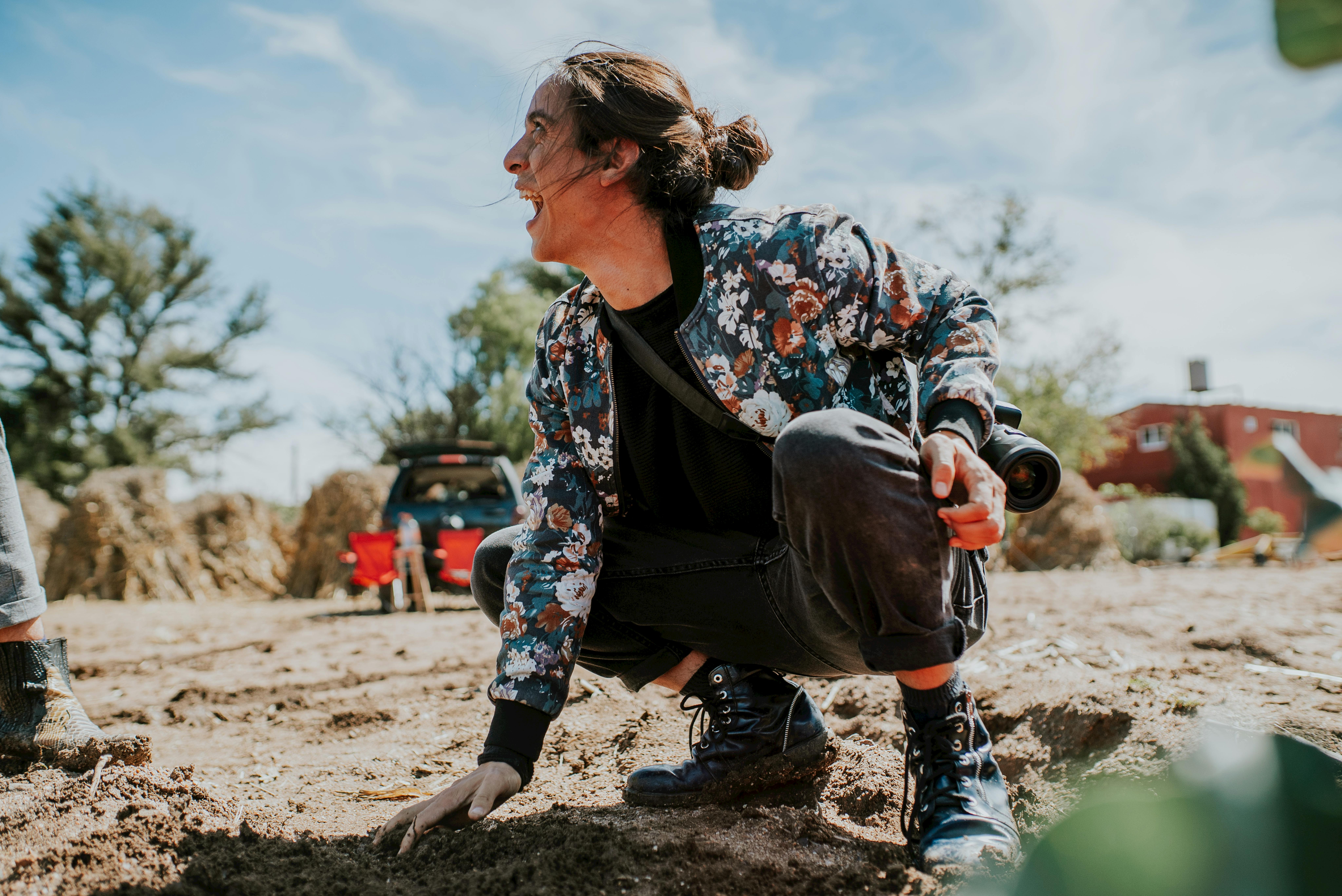 Woman Touching ground in Countryside · Free Stock Photo