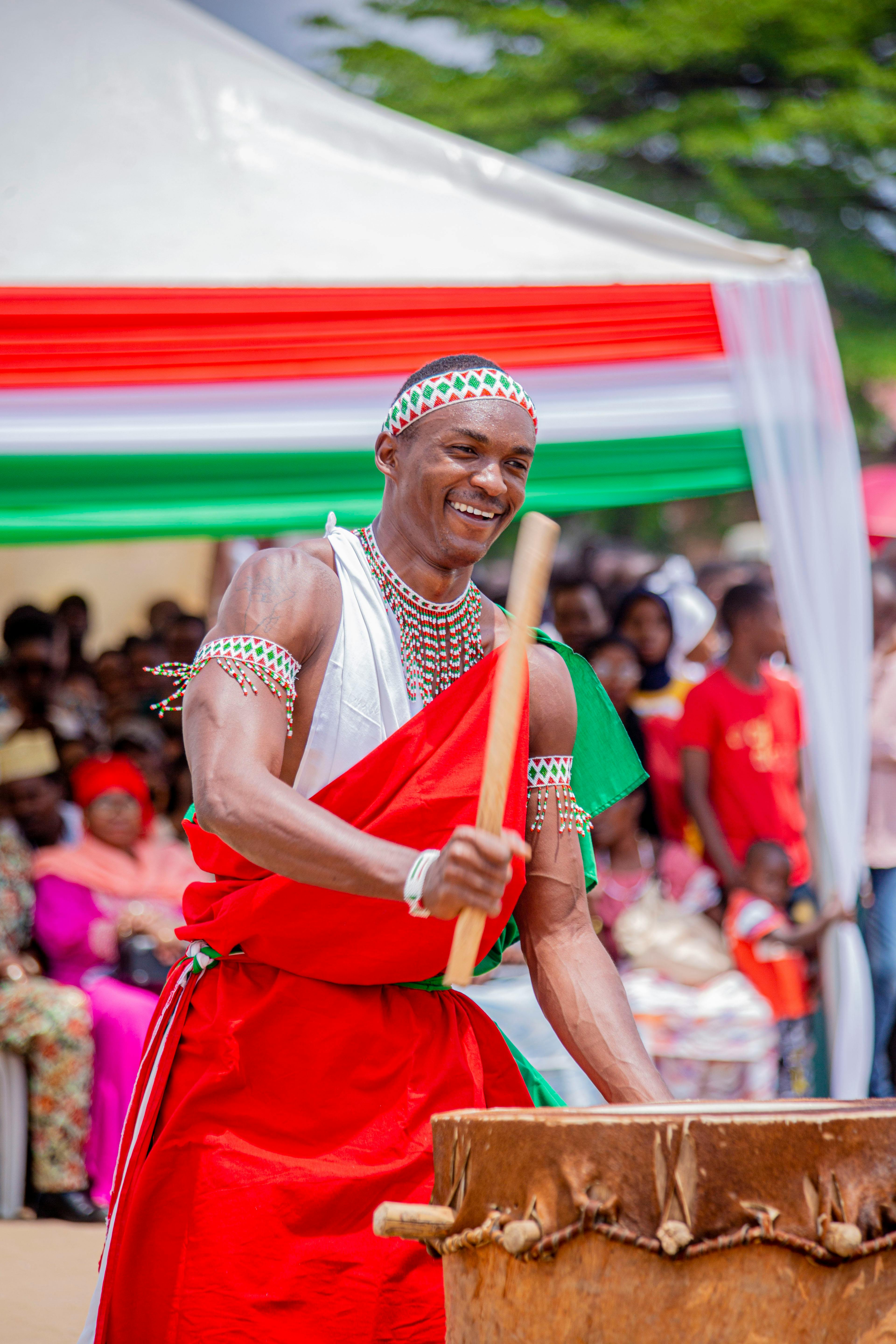 Man Playing a Drum for a Crowd · Free Stock Photo
