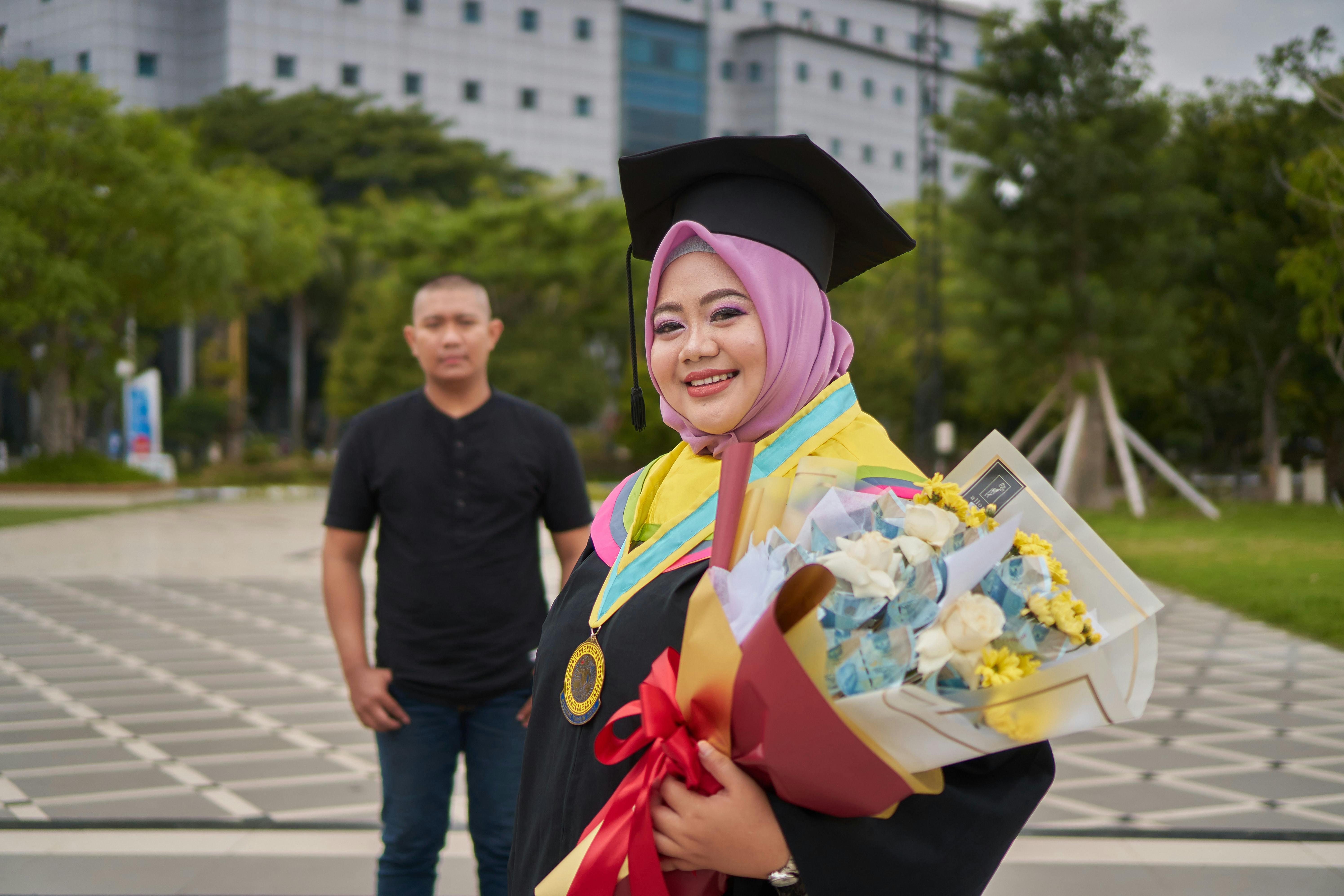 Woman in Graduation Gown · Free Stock Photo