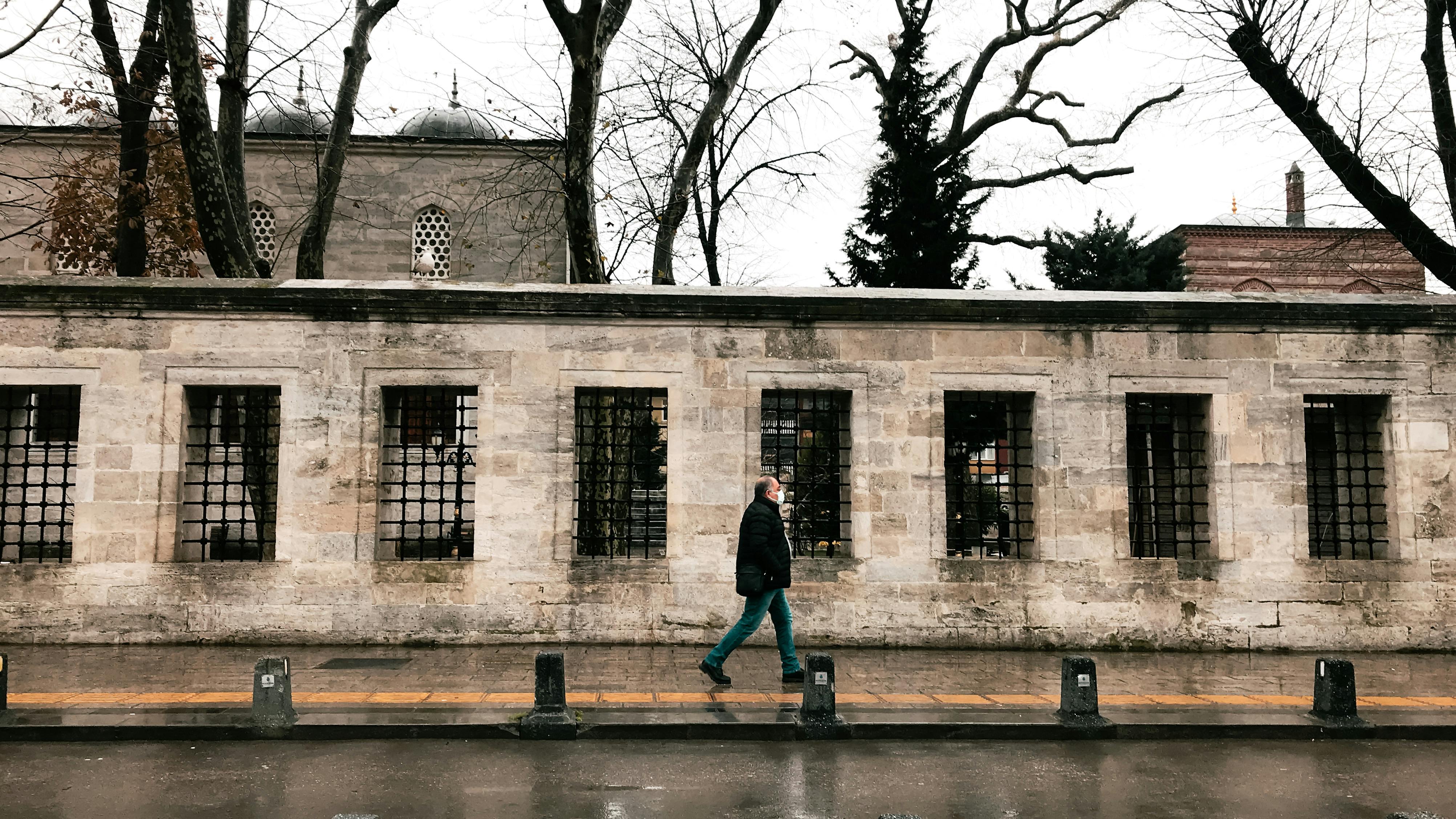 Side View of Monks Walking on a Sidewalk · Free Stock Photo