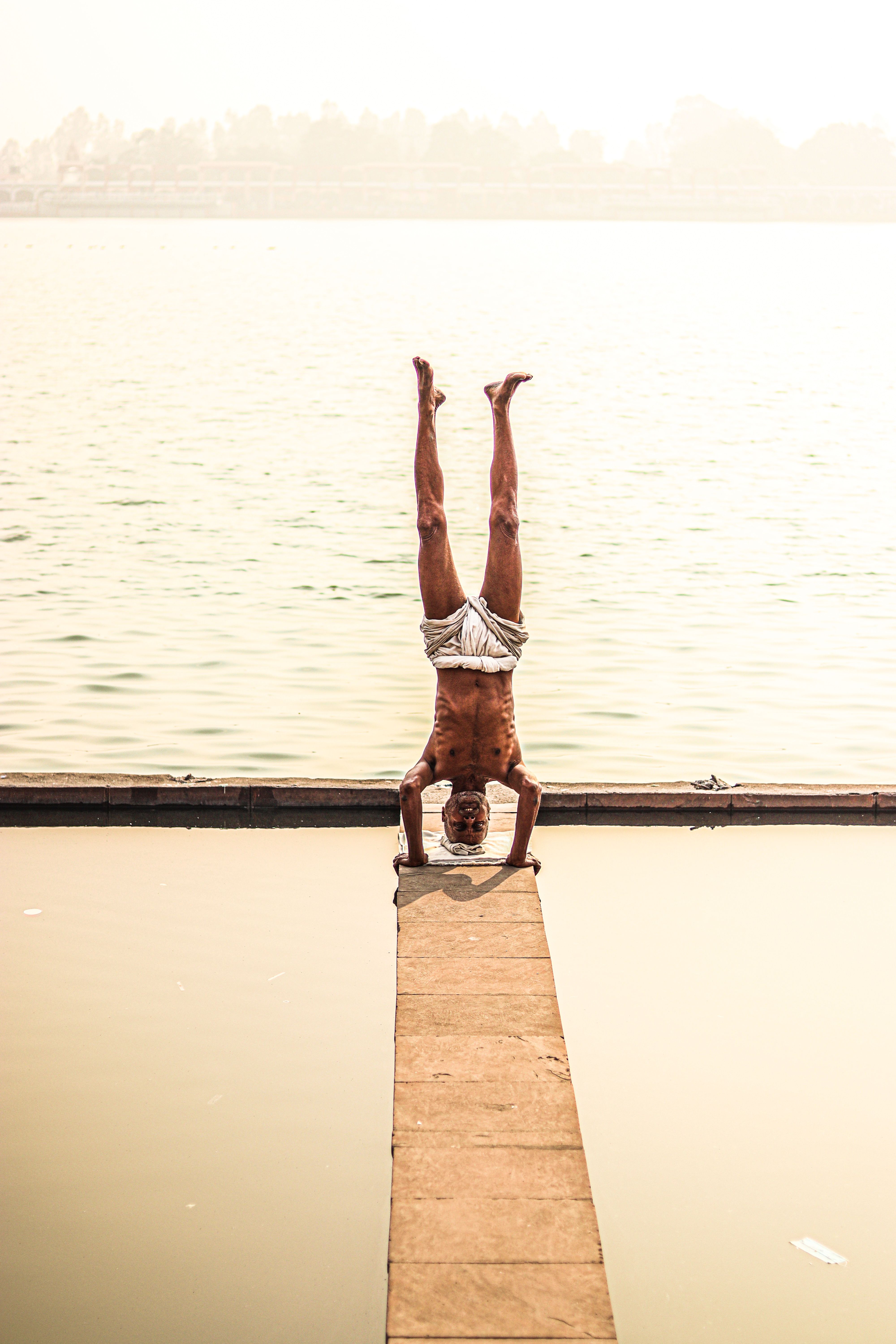Woman Stretching a Man's Arms · Free Stock Photo