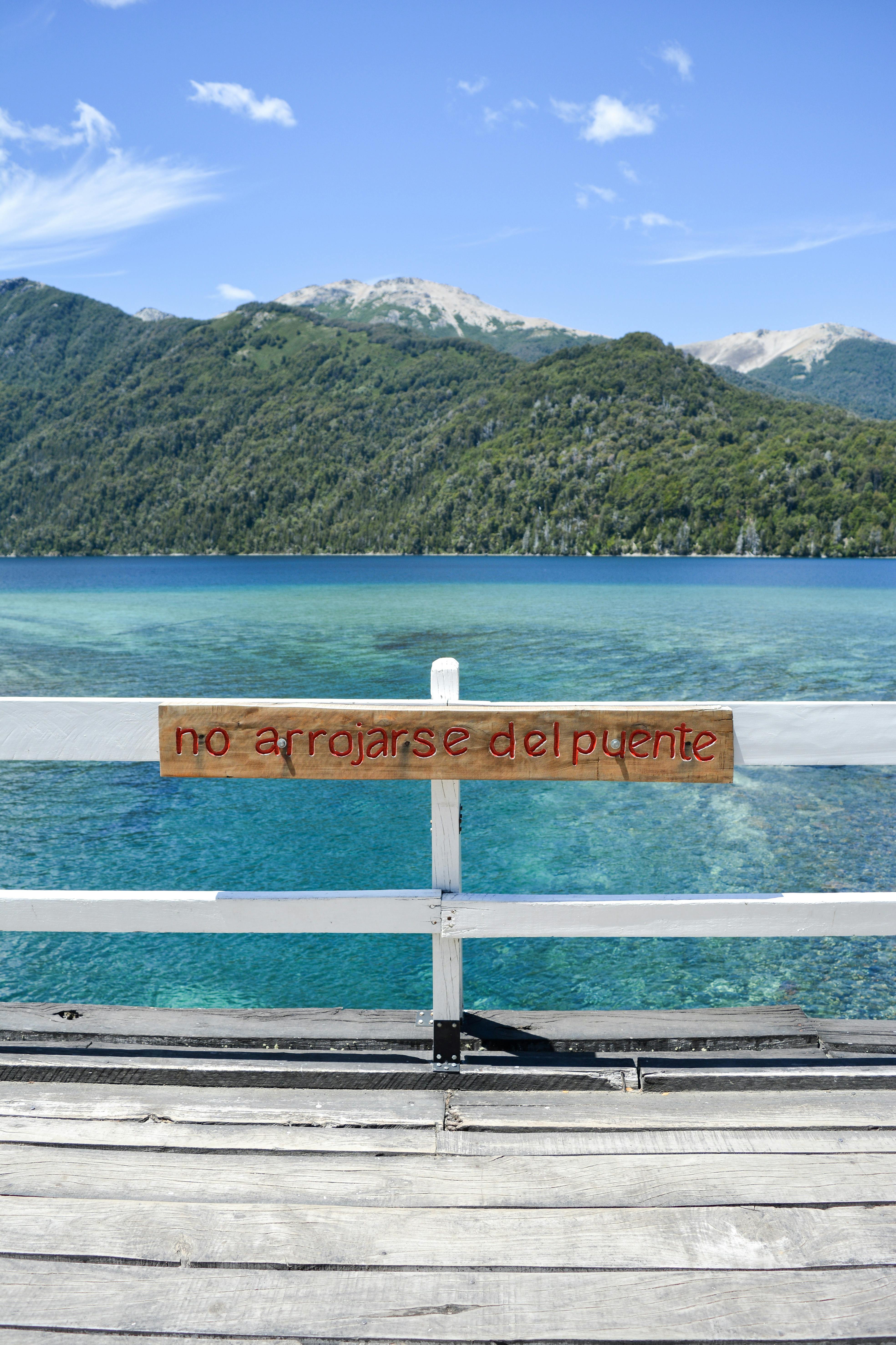 Wooden Signage on a Railing · Free Stock Photo
