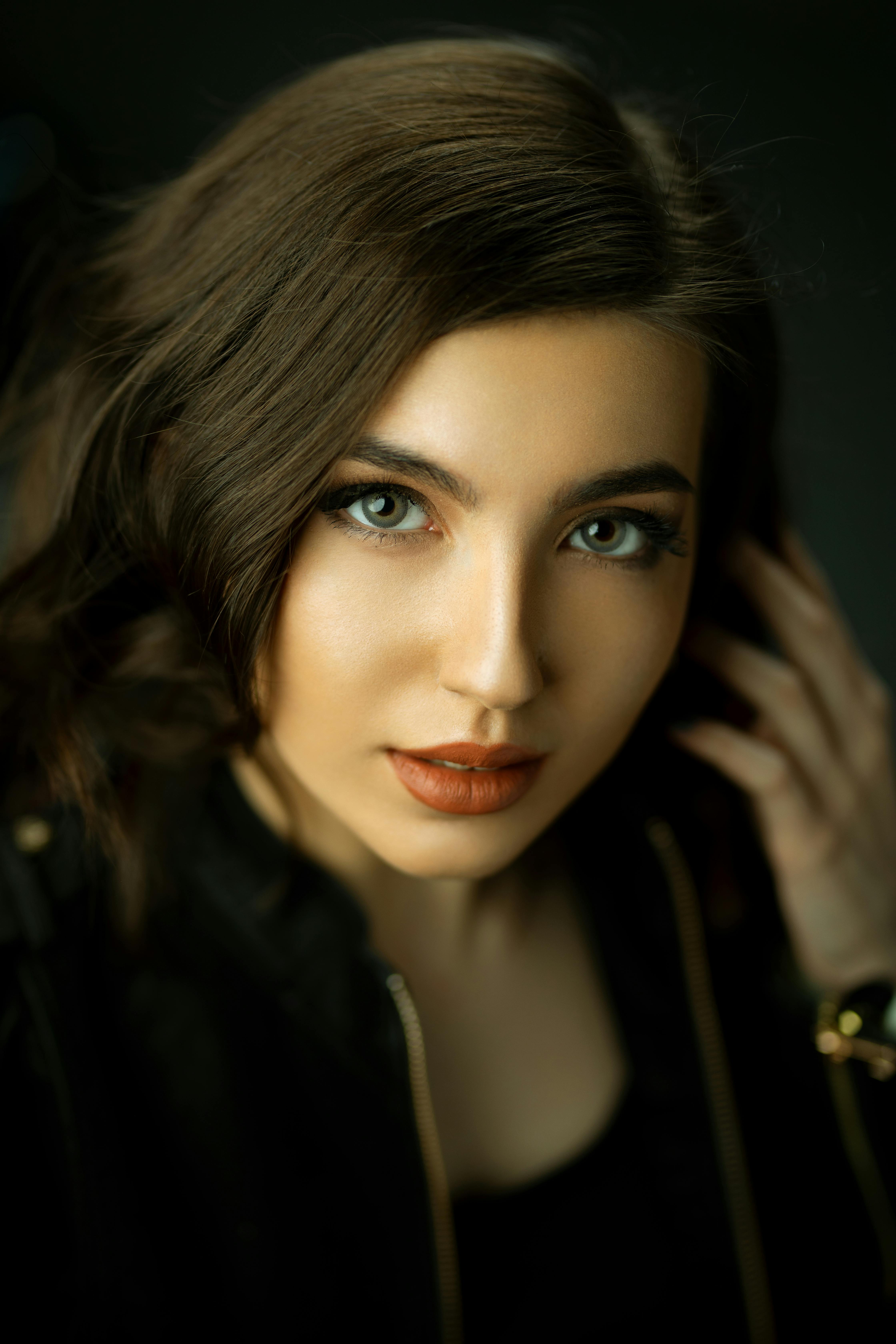 Portrait of Young Woman Sitting Backwards on Chair · Free Stock Photo