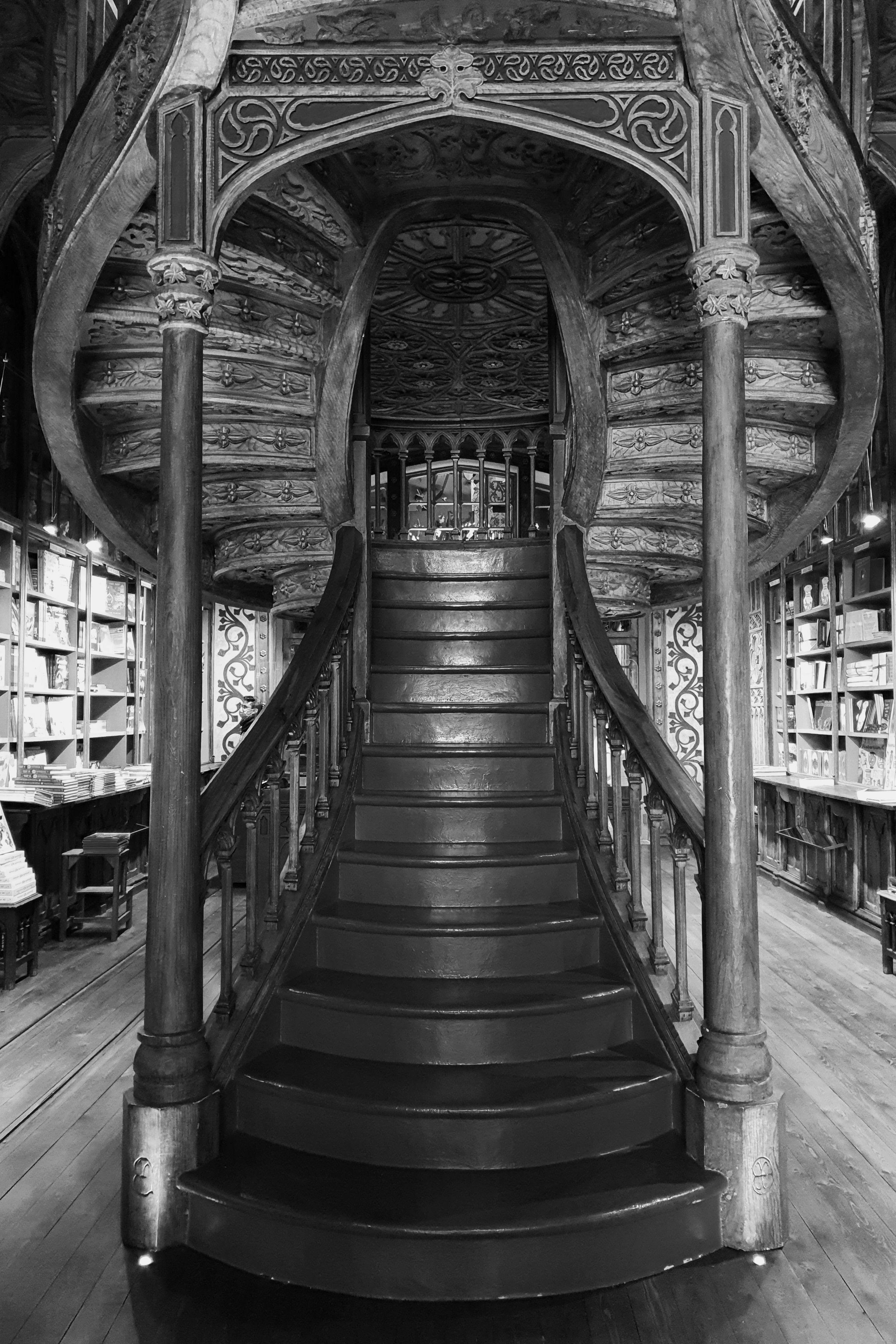 Grayscale Photo of Wooden Stairs in the Library · Free Stock Photo