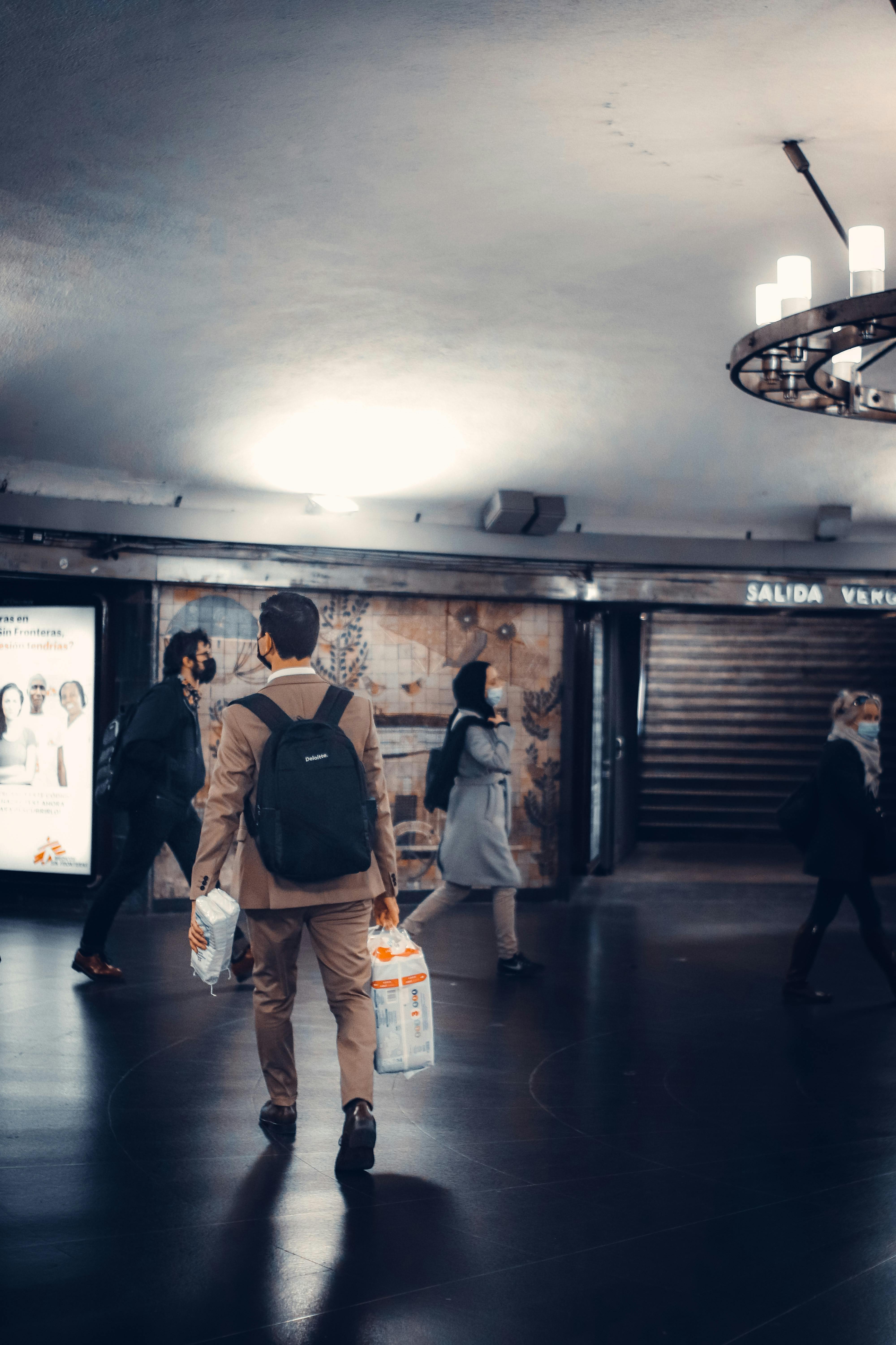 Overexposed Photo of People Standing in Ballroom · Free Stock Photo