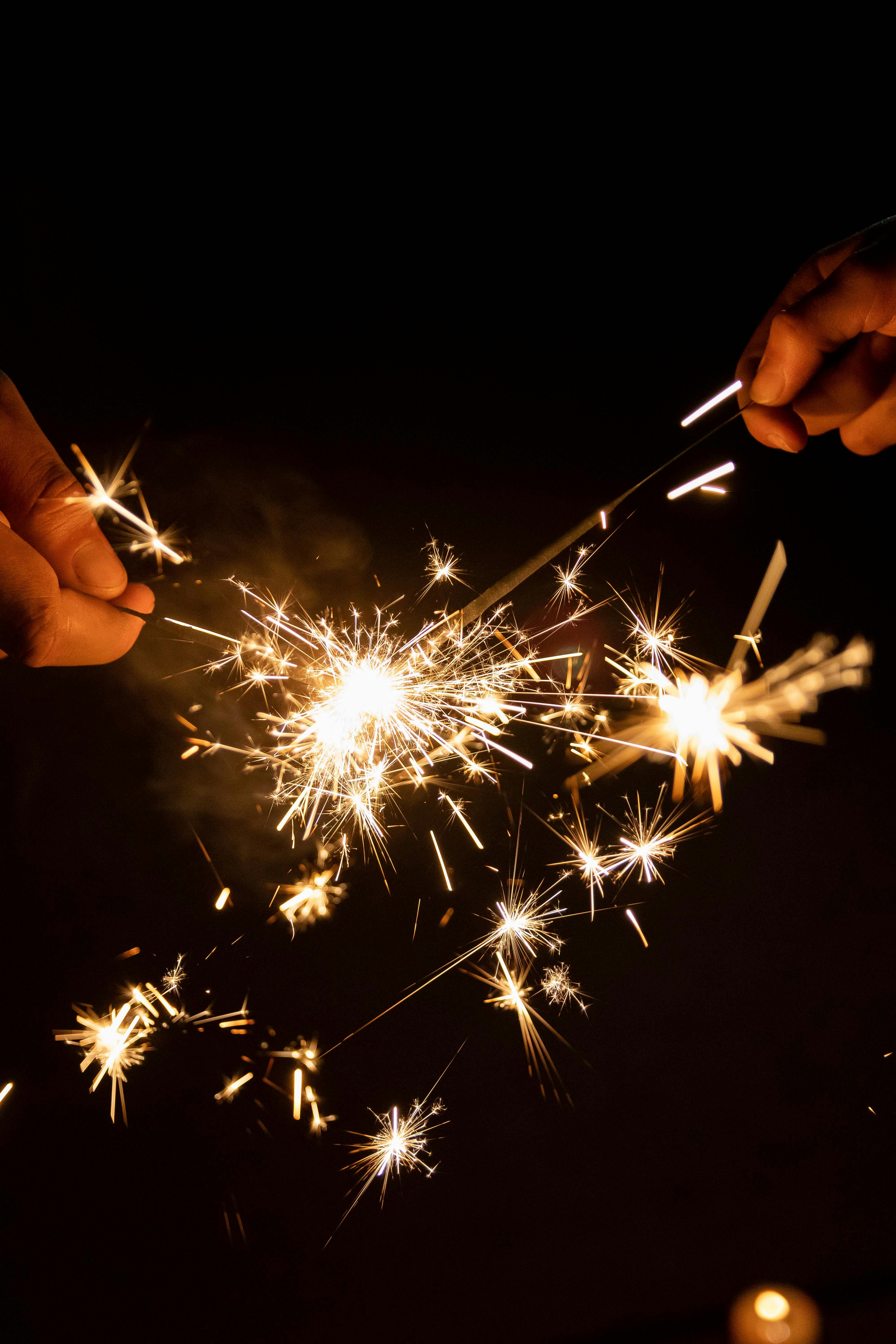 Photo of a Person's Hand Holding Firecracker · Free Stock Photo