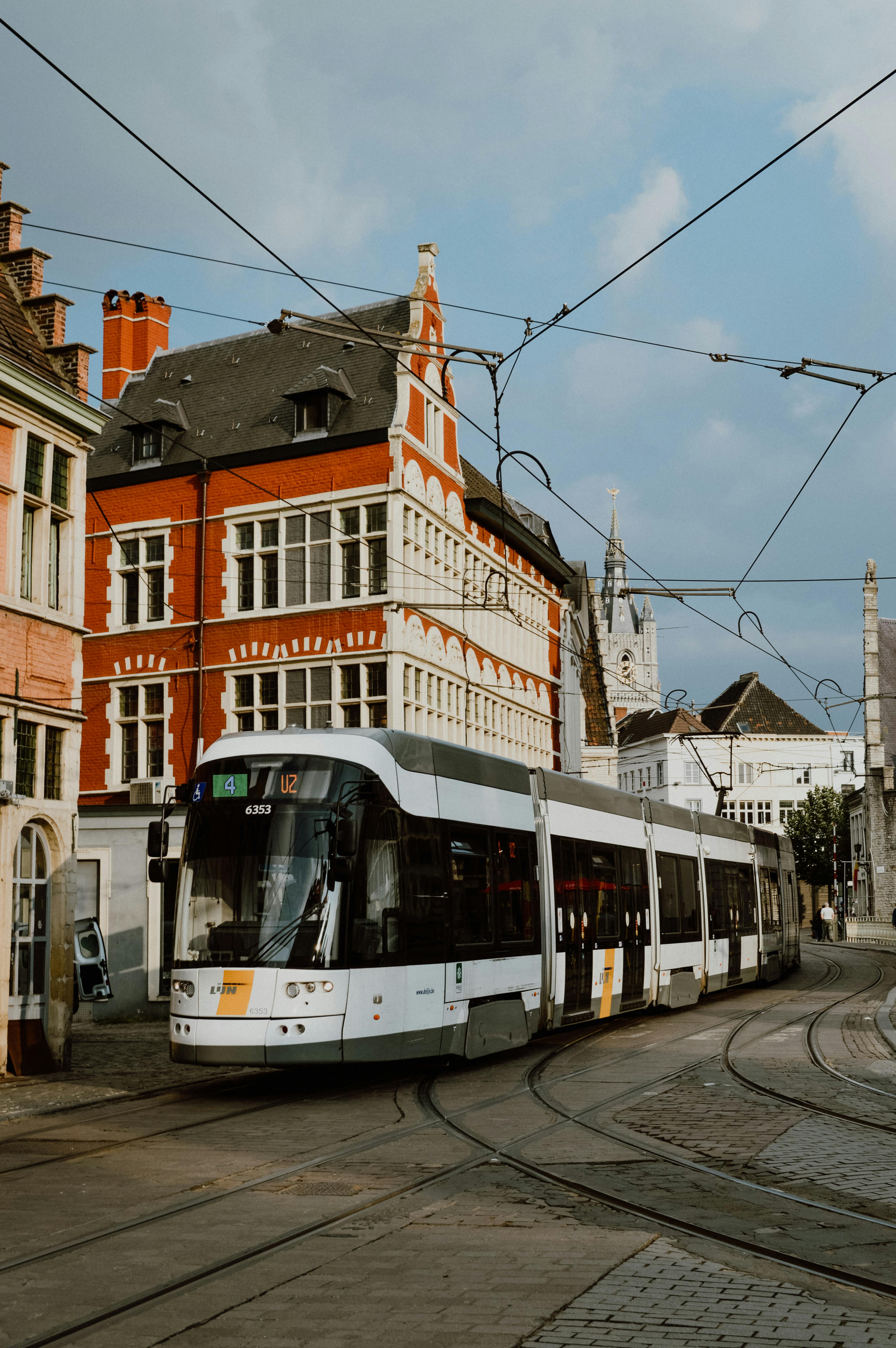 Grayscale Photo of Tram on Road · Free Stock Photo