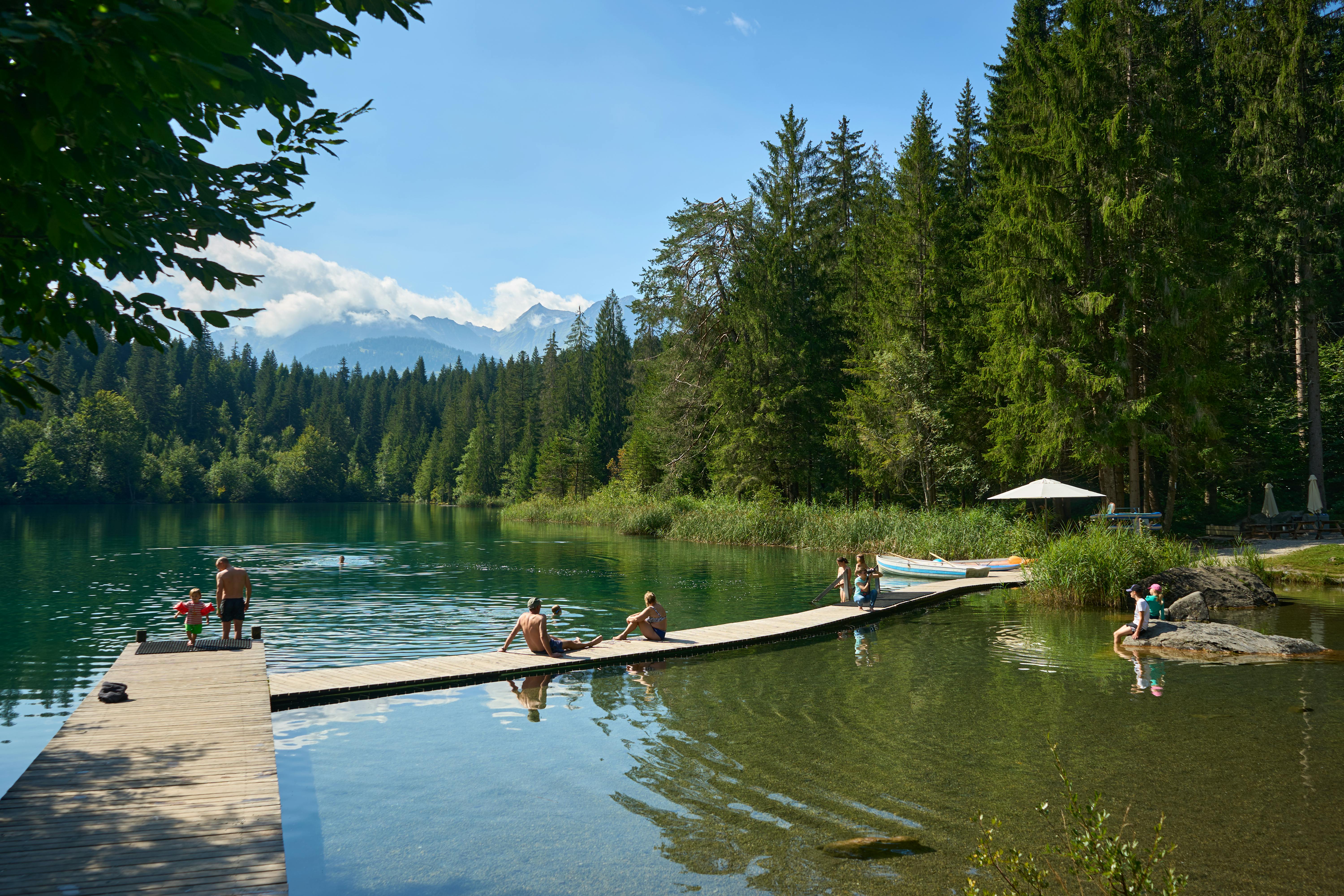 People Relaxing Near Body of Water · Free Stock Photo