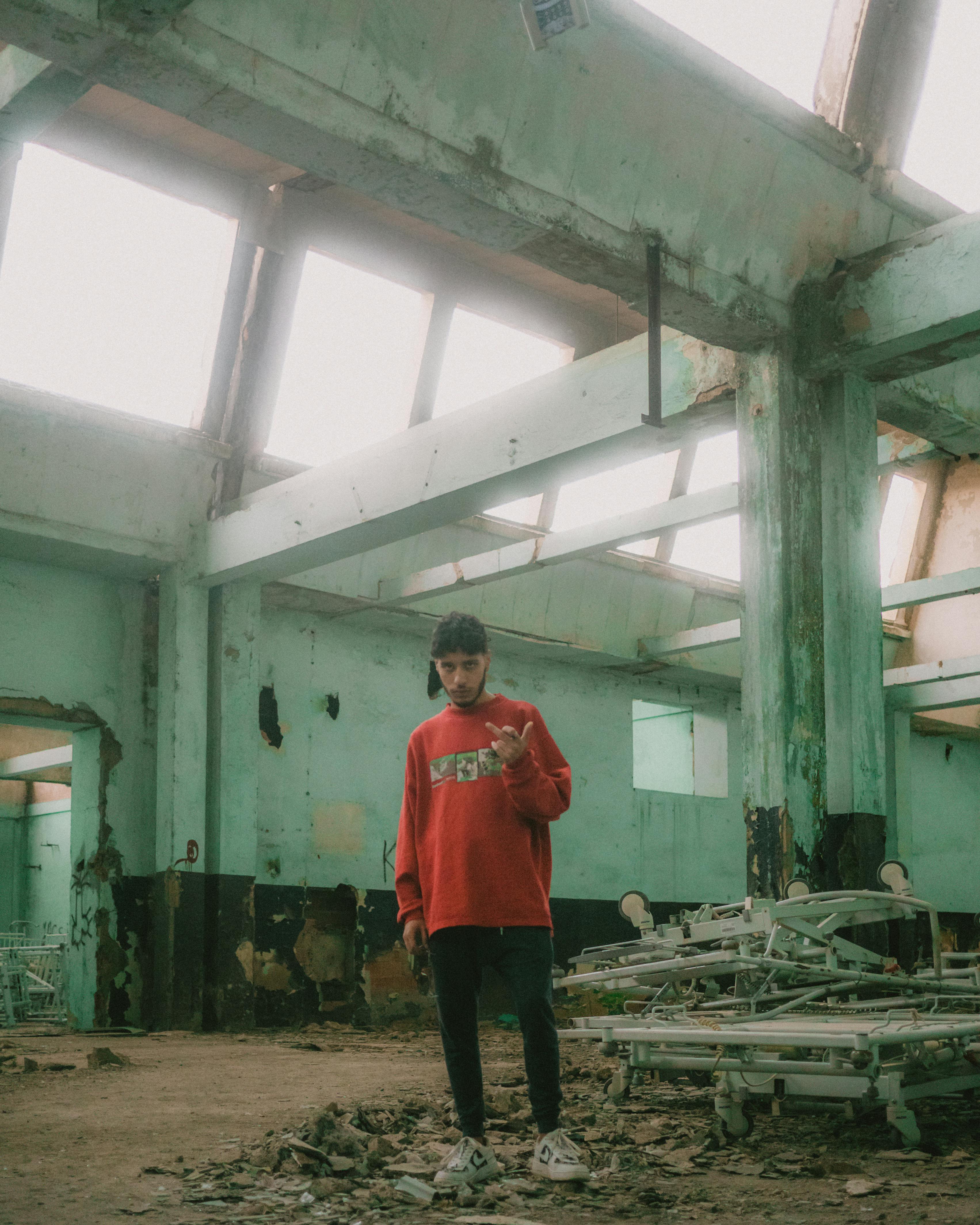 Person Dressed as Ghost Posing with Sneaker in Hand · Free Stock Photo