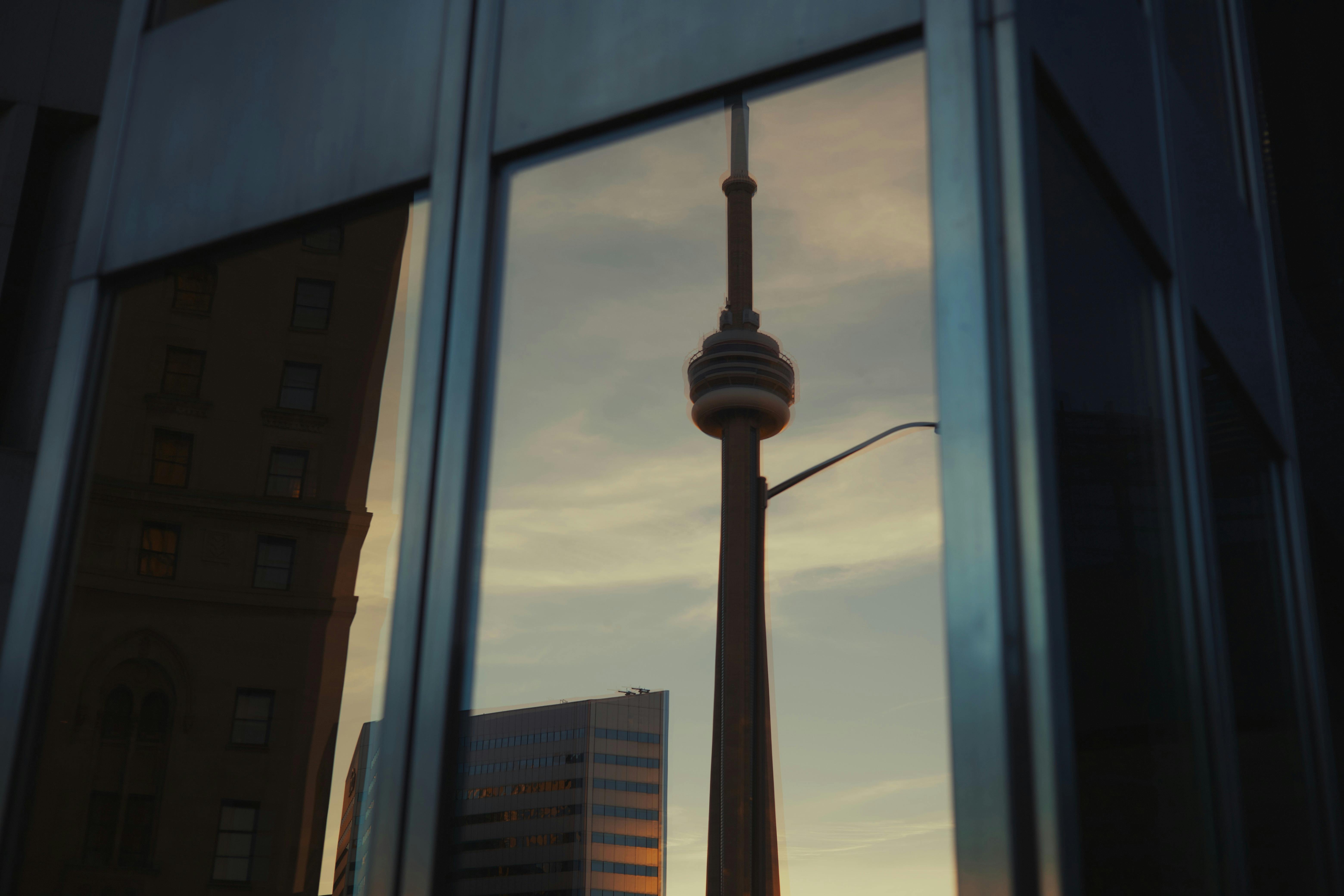 A Reflection of the CN Tower on a Glass Window · Free Stock Photo