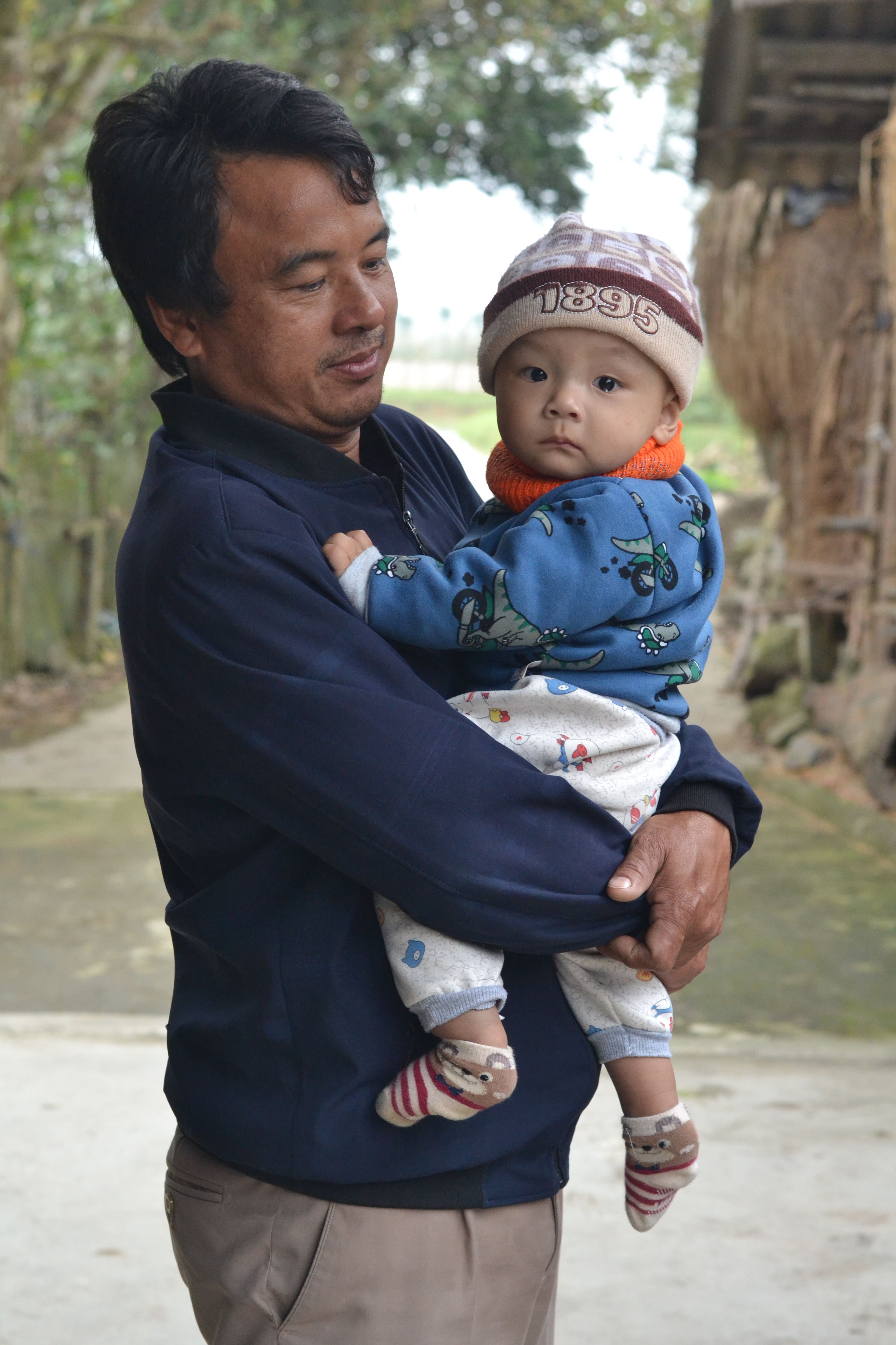 A Man Carrying His Child · Free Stock Photo