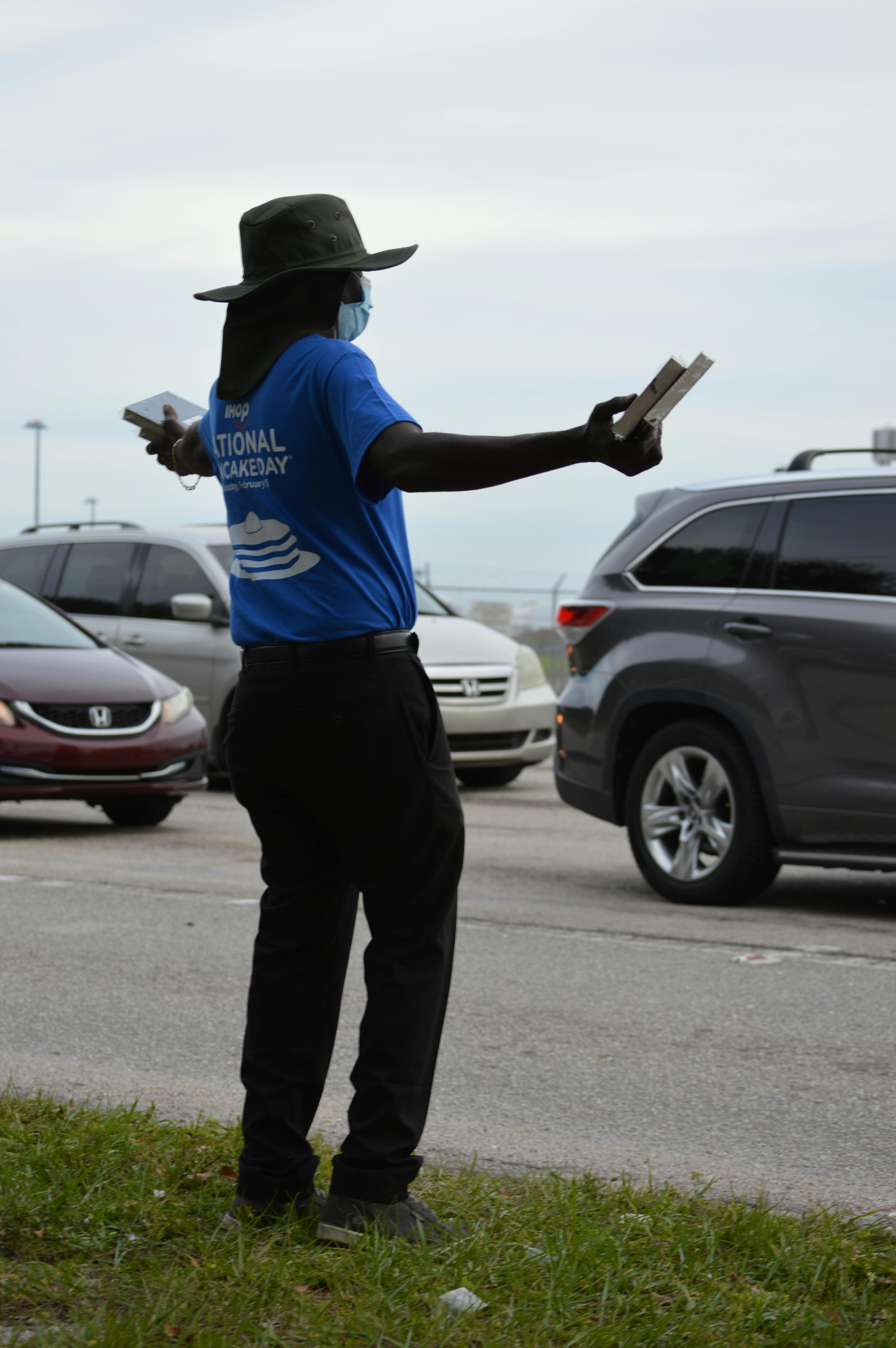 Giving Out Flyers On The Street Photos, Download The BEST Free Giving ...