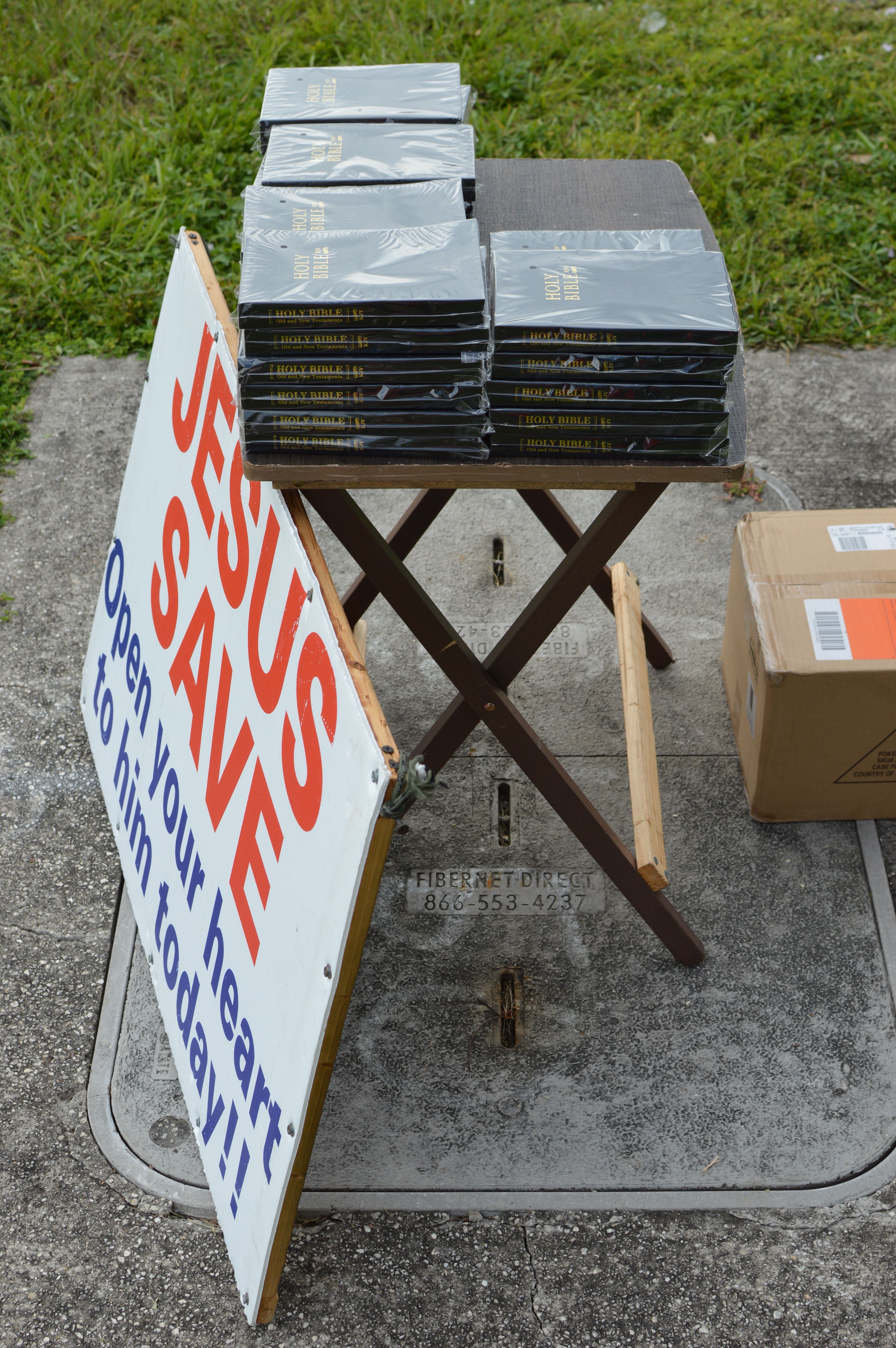 Bible and Poster on a Table · Free Stock Photo