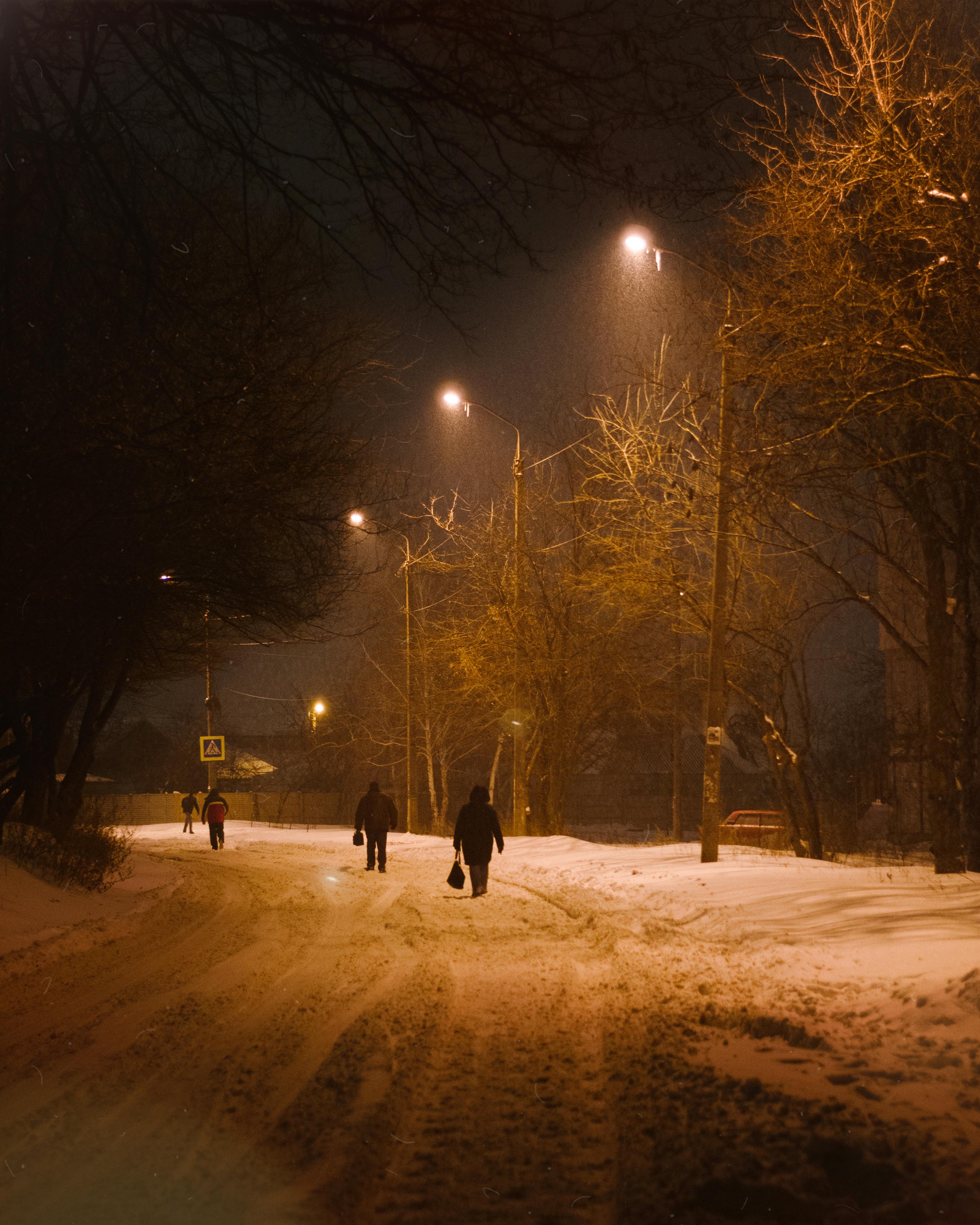 People Walking on Snow Covered Ground during Night Time · Free Stock Photo