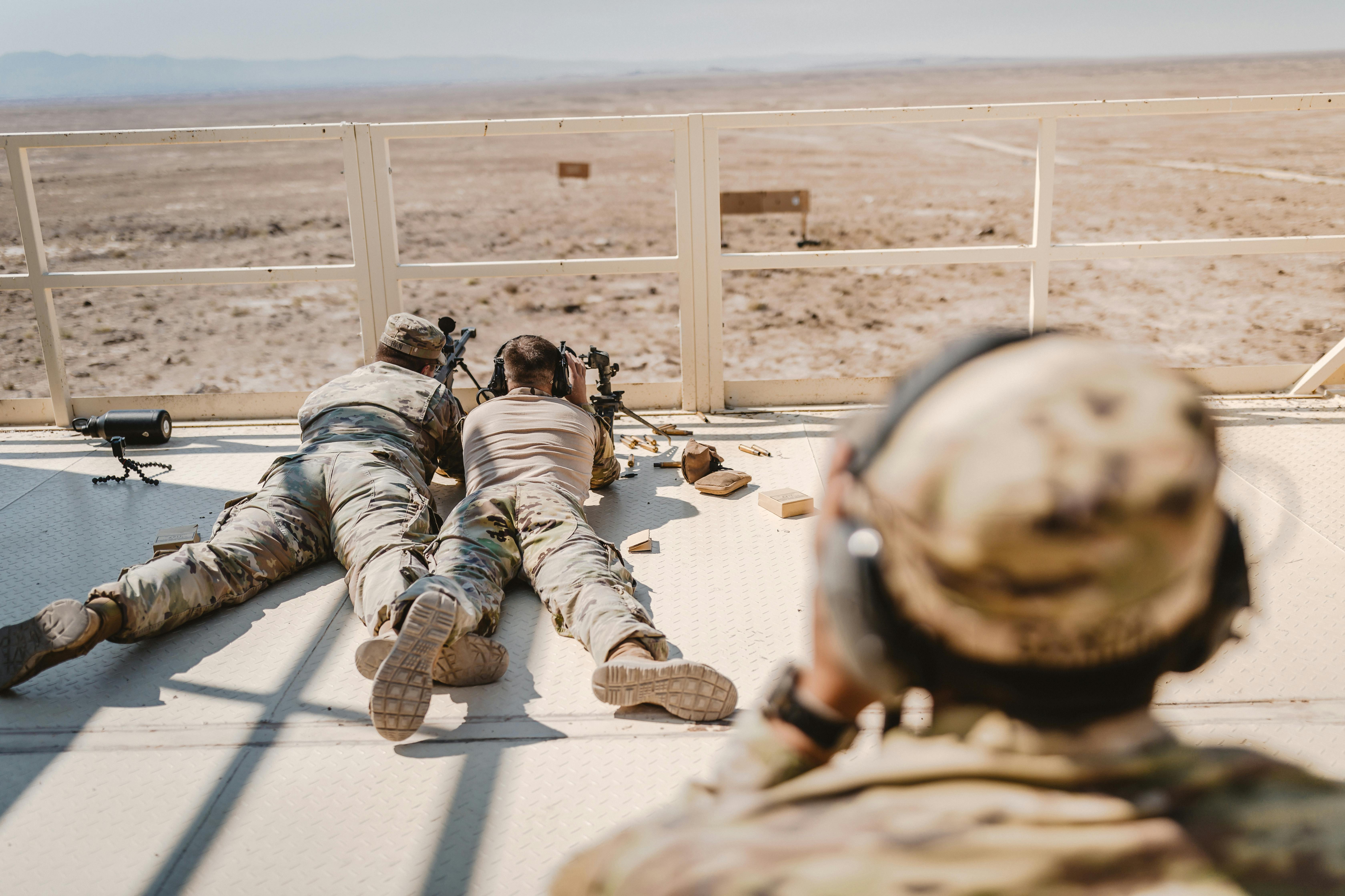 Snipers Lying on Front on Balcony · Free Stock Photo
