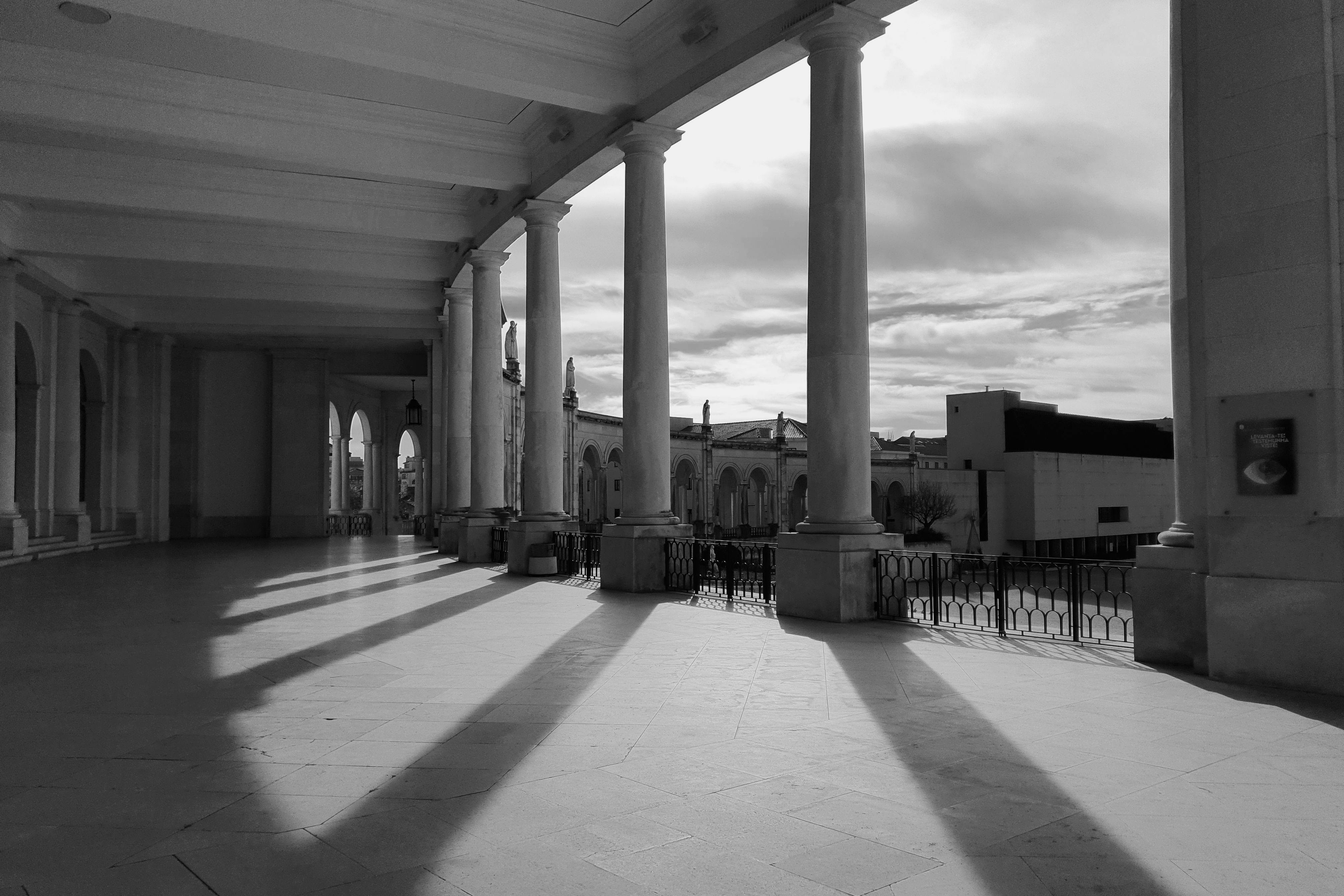 Grayscale Photo of Concrete Pillars · Free Stock Photo