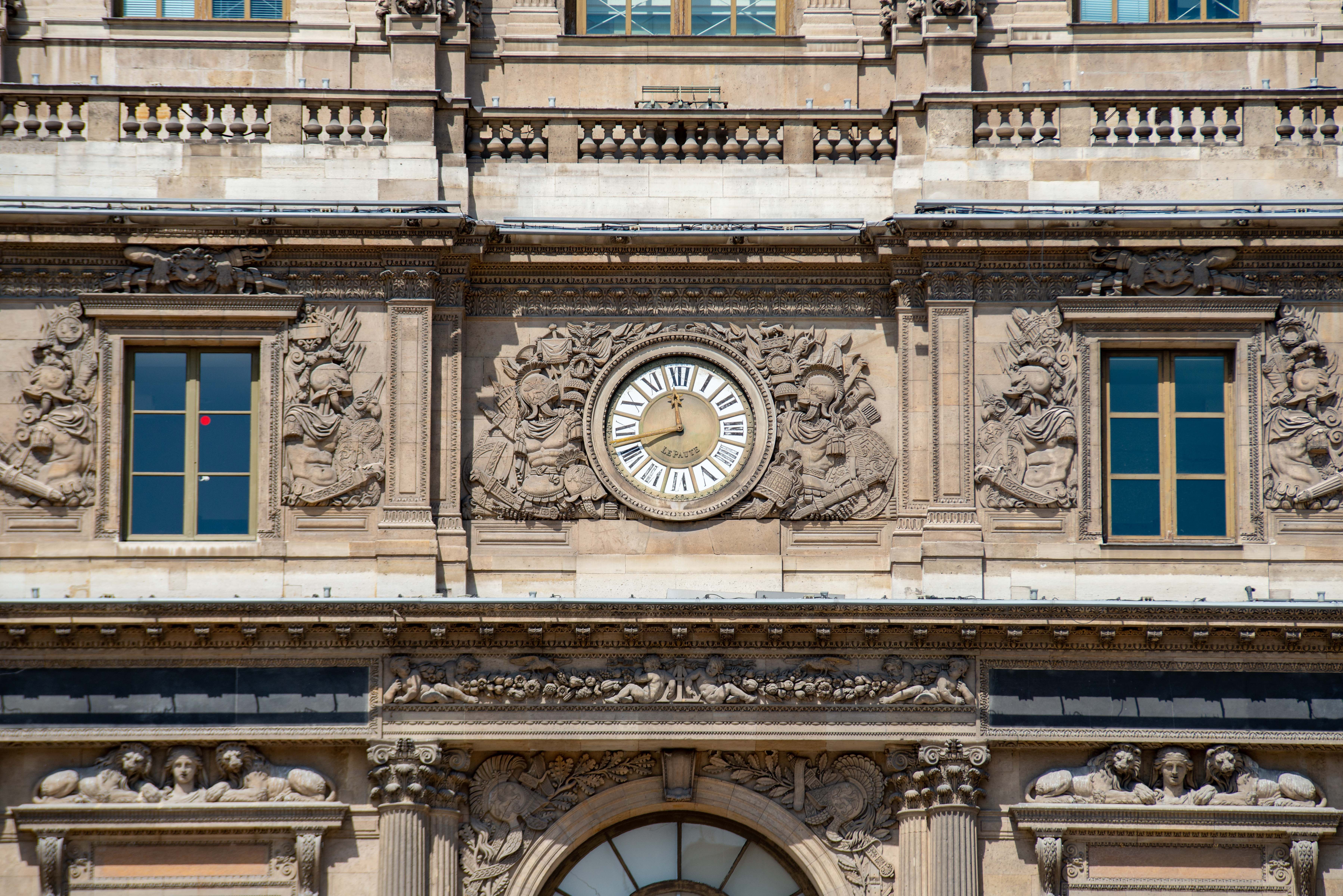 Clock on Medieval Building Wall · Free Stock Photo