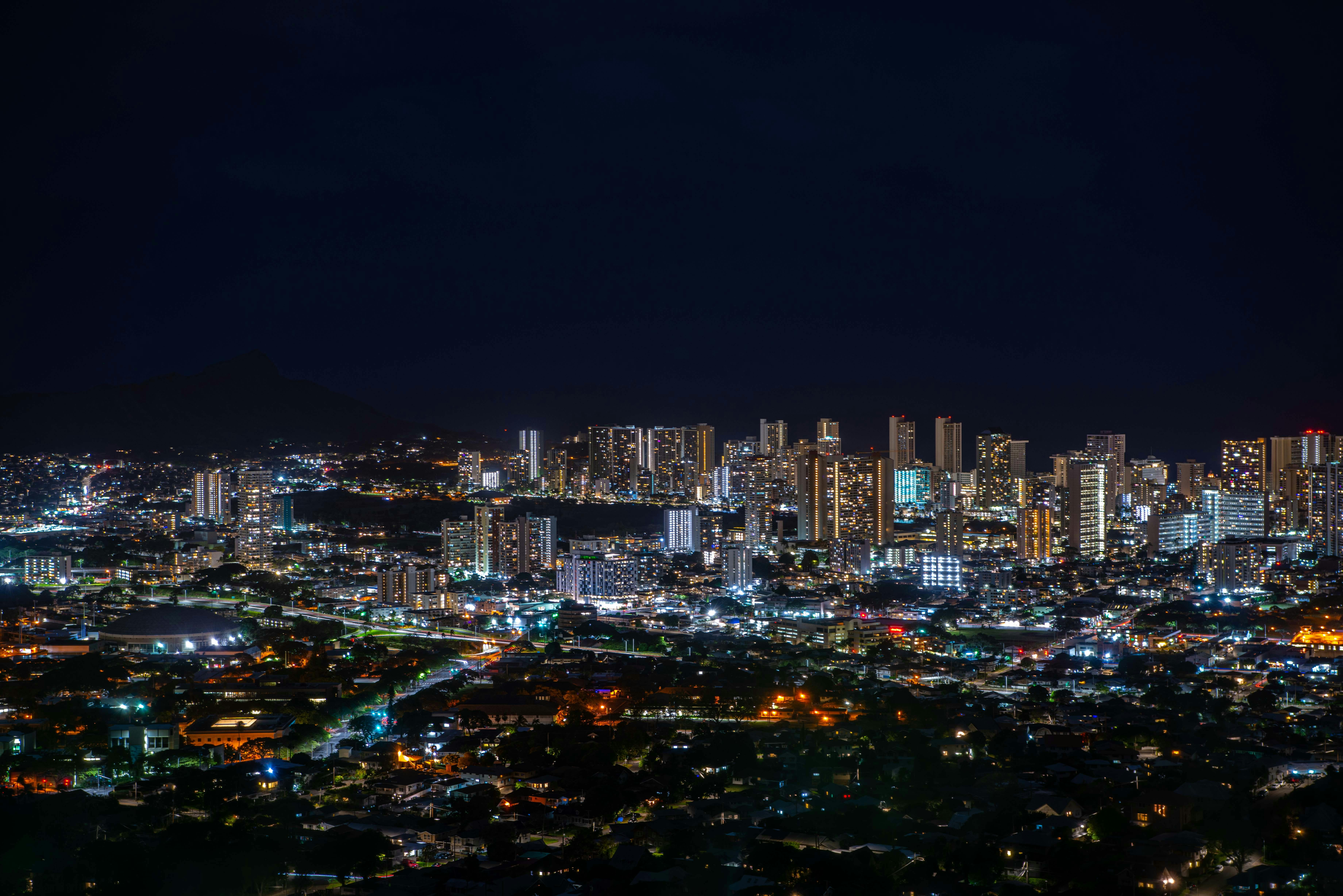 City With High Rise Buildings During Night Time · Free Stock Photo