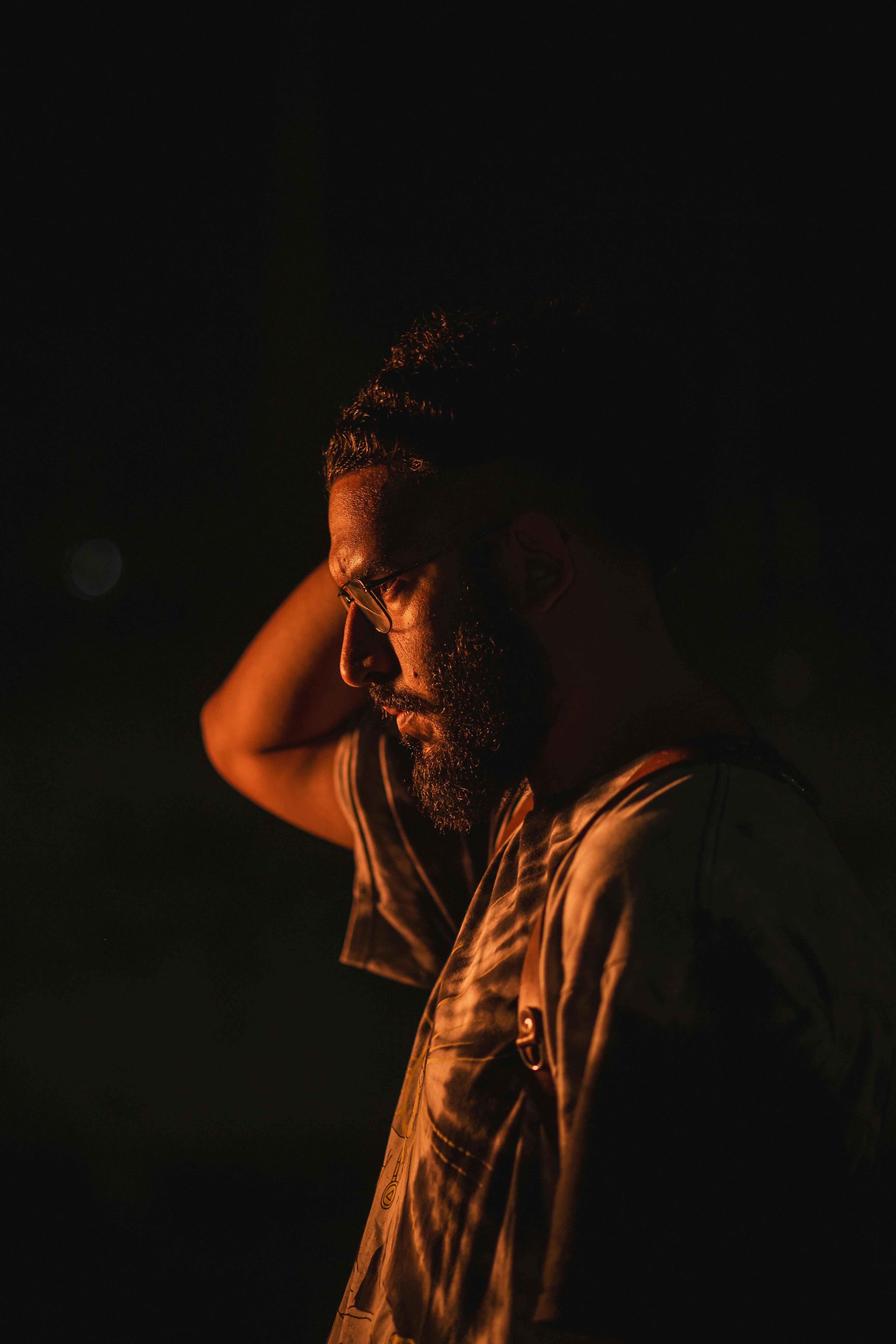 Side View Shot of a Bearded Man Looking Afar · Free Stock Photo
