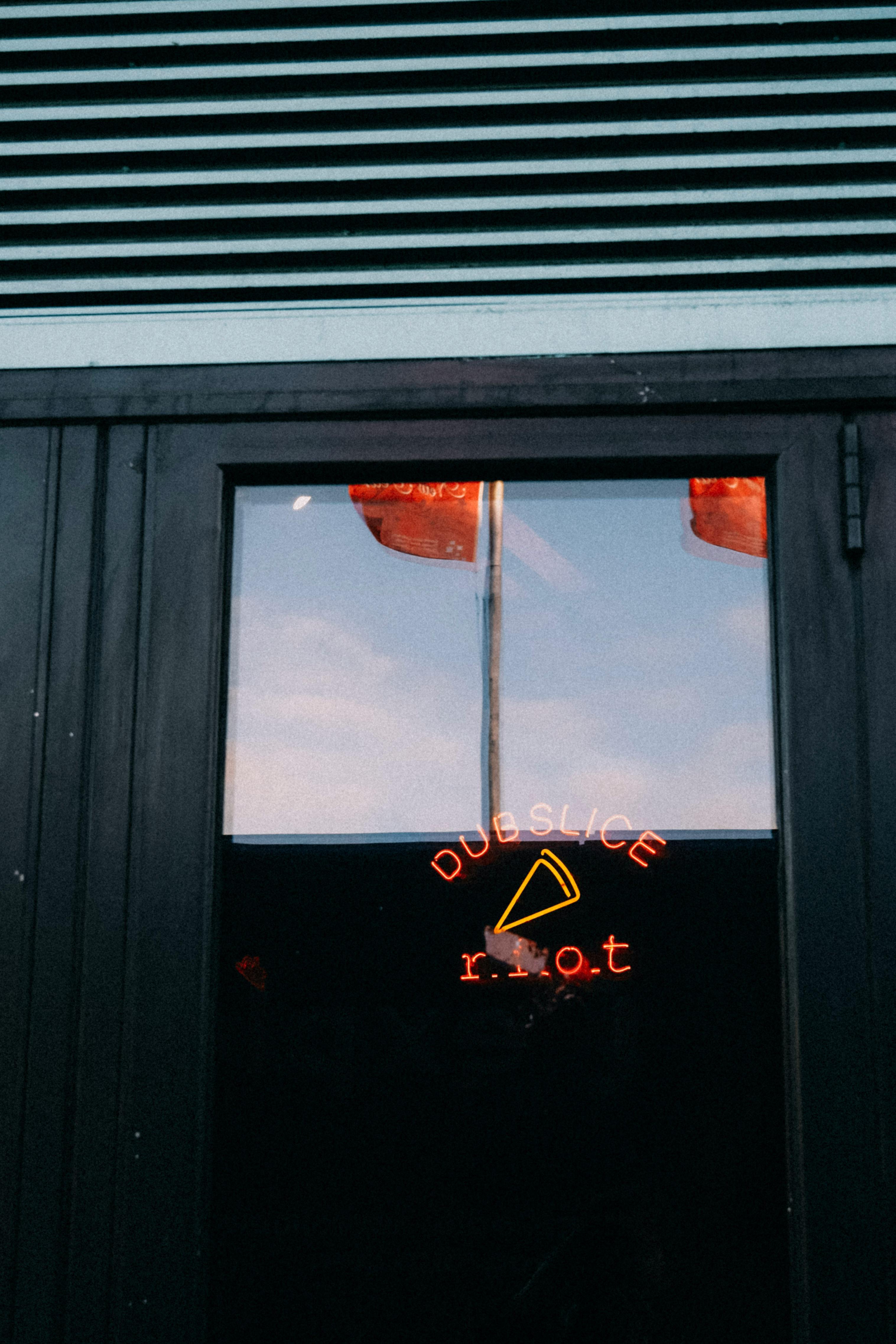 Neon Signage on a Window · Free Stock Photo