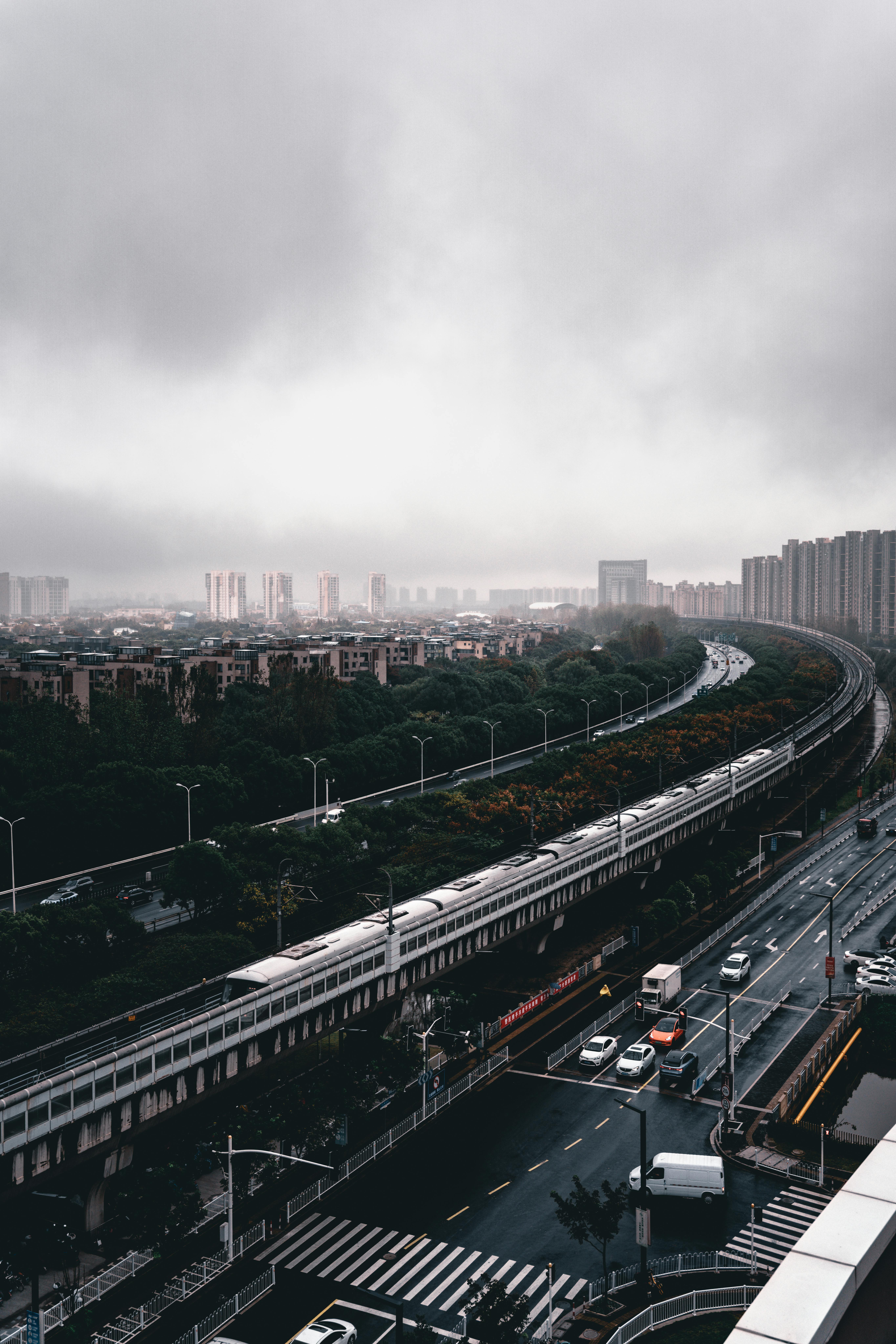 Overcast Sky over City Buildings and a Road · Free Stock Photo