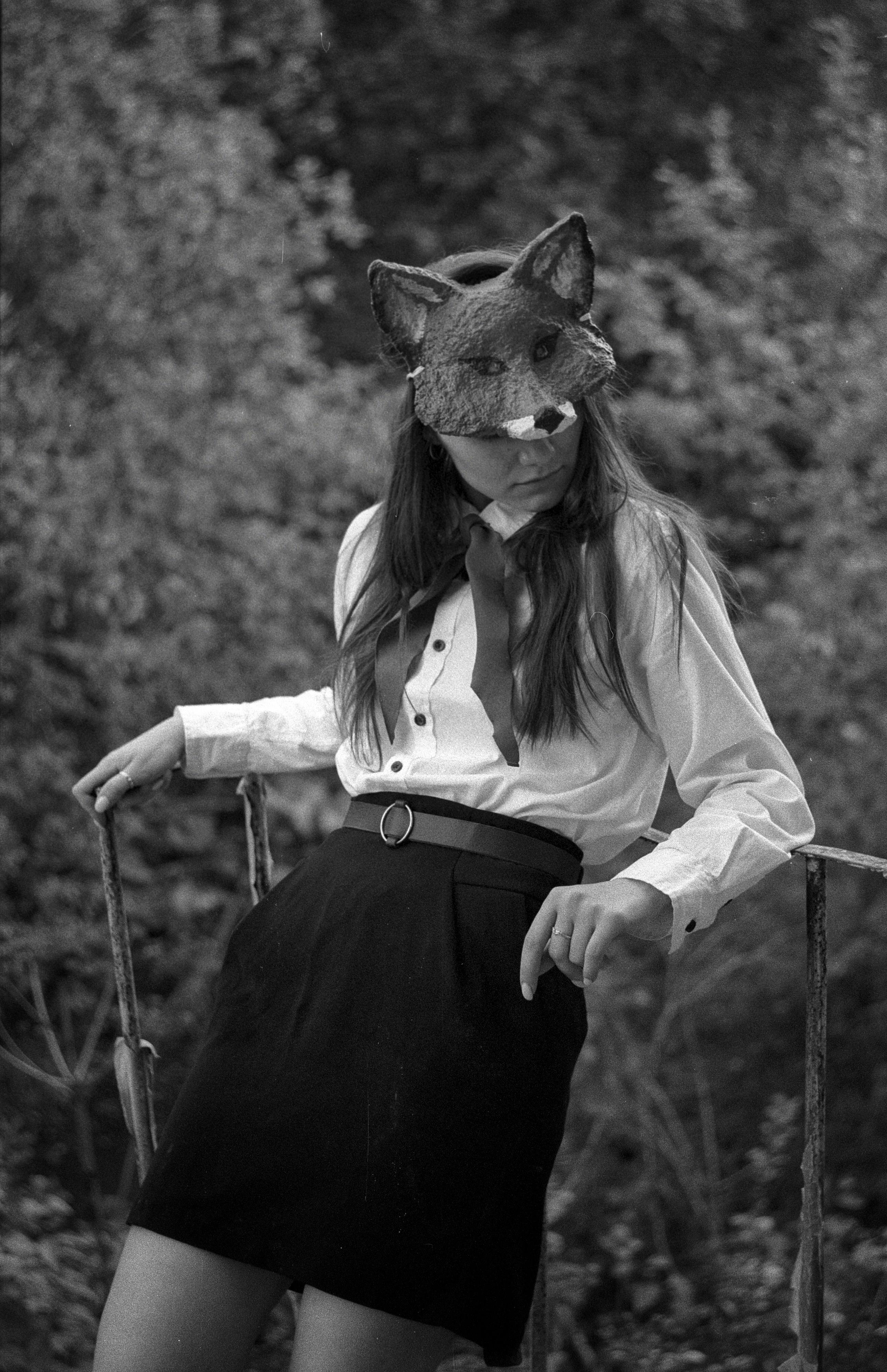 Grayscale Photo of a Woman Leaning on the Railing · Free Stock Photo