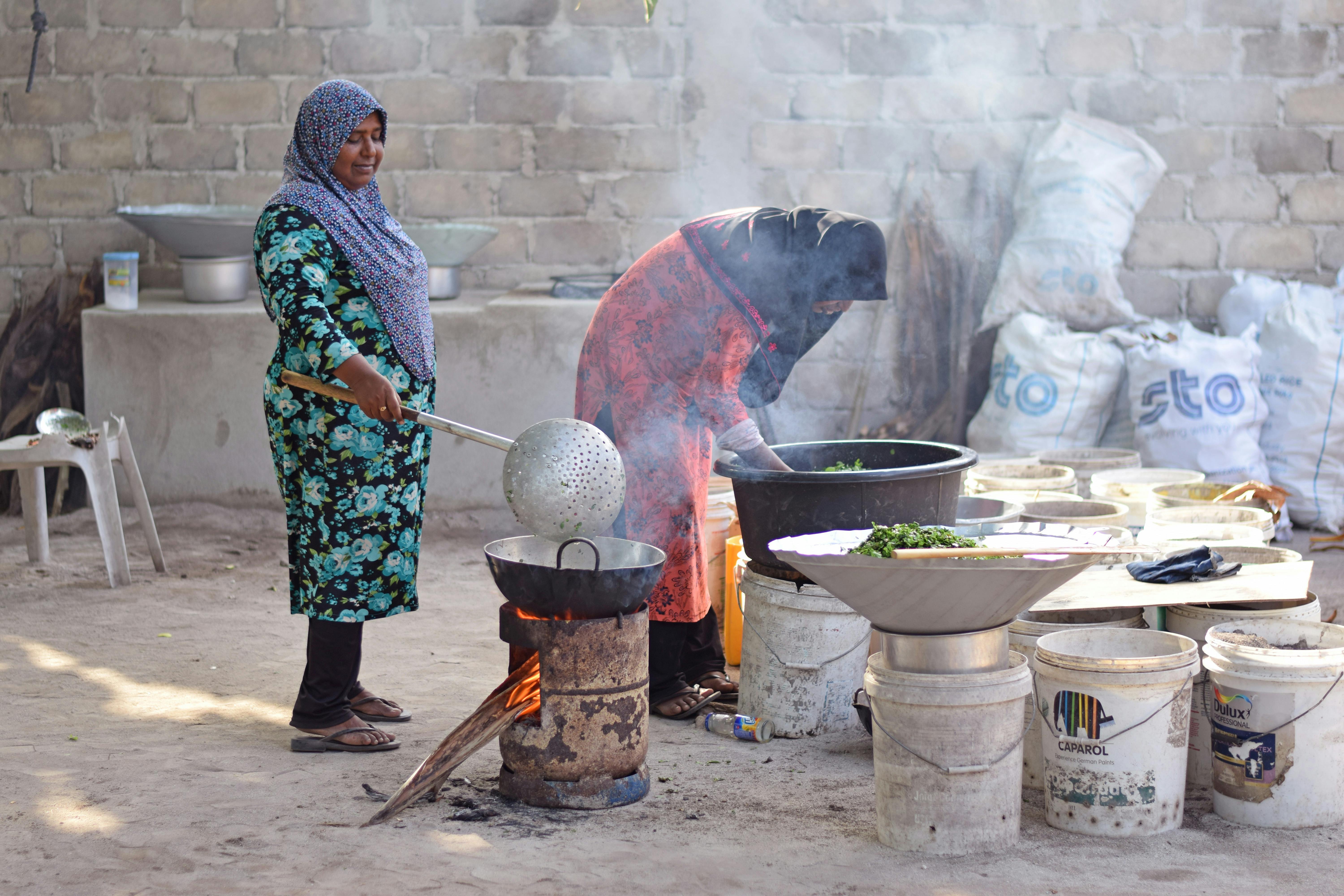 Women Cooking in Their Yard · Free Stock Photo