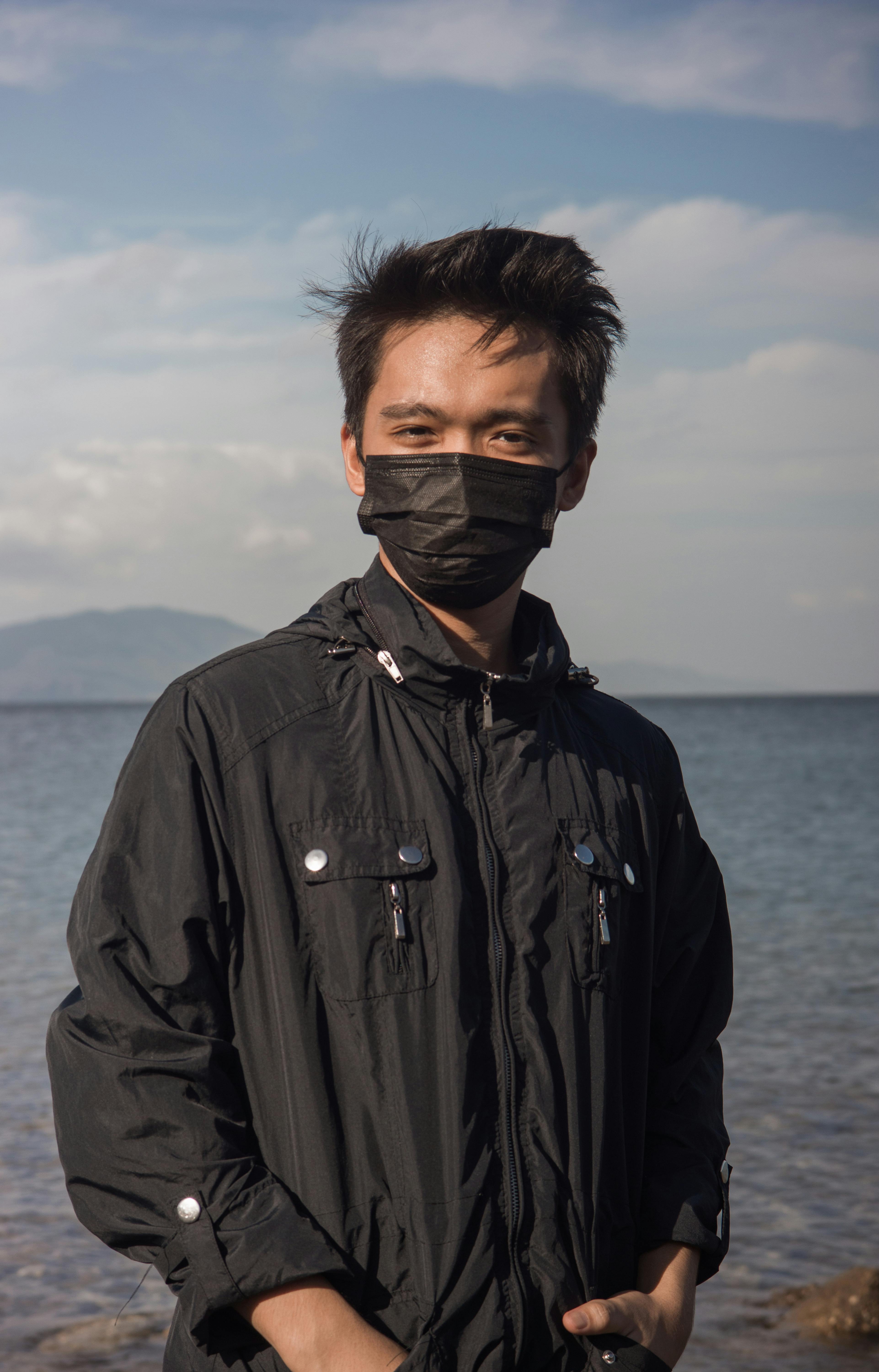 Men in Traditional Orange Robes Wearing Face Masks During a Ceremony ...